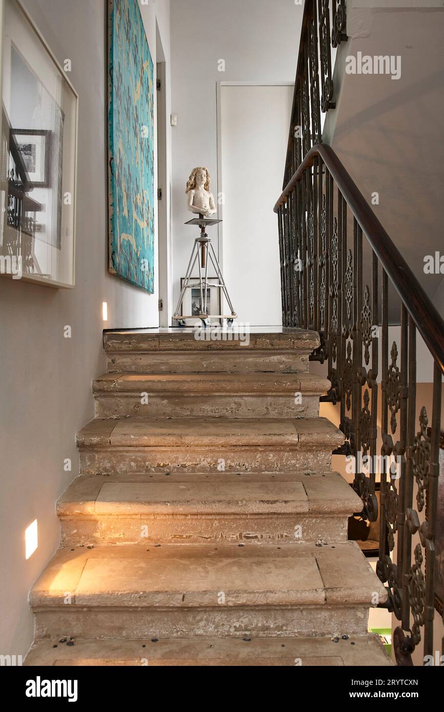 View up stairs to first floor landing. End House, Kensington, United ...
