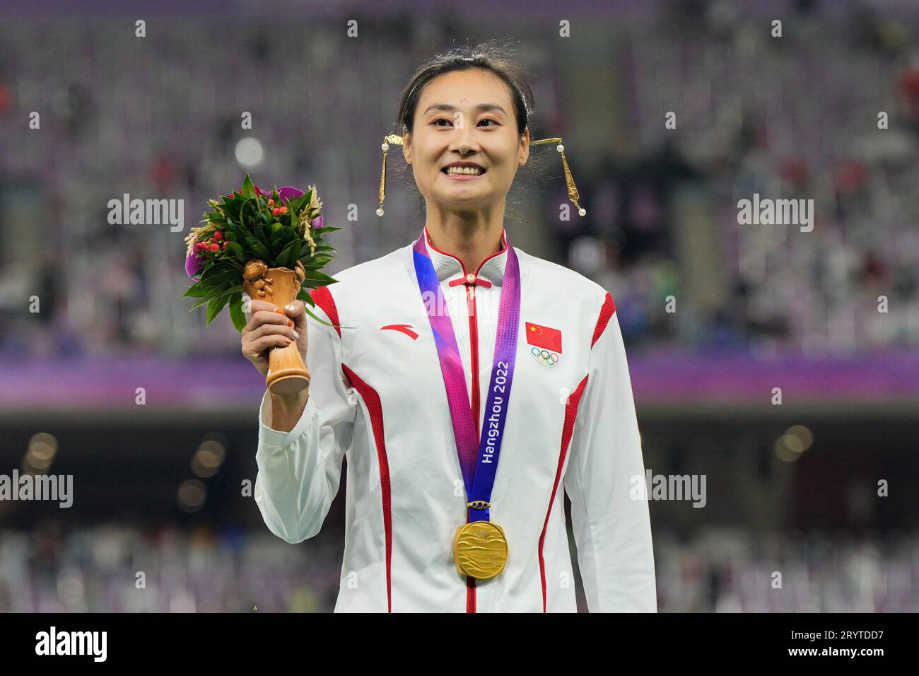 Gold medalist China's Li Ling celebrates on the podium during the ...