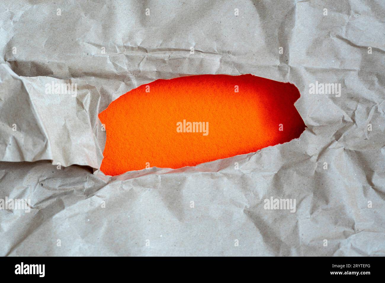 hole in paper with color paper background inside. Good paper texture ...