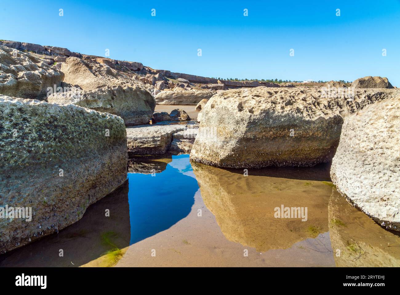 Ancient rocks on the sea coast Stock Photo - Alamy