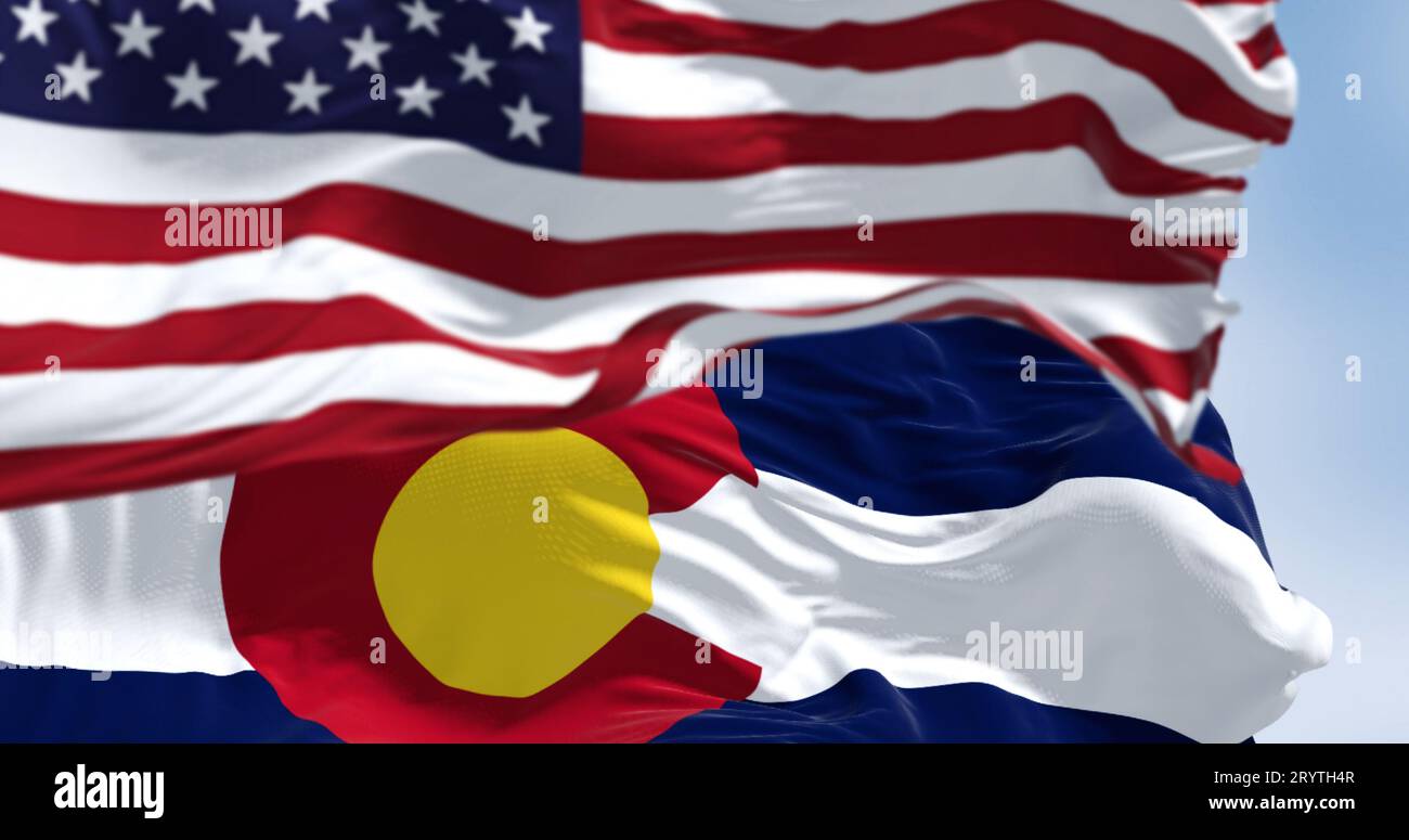 Flags of Colorado and the US waving in the wind on a clear day Stock ...