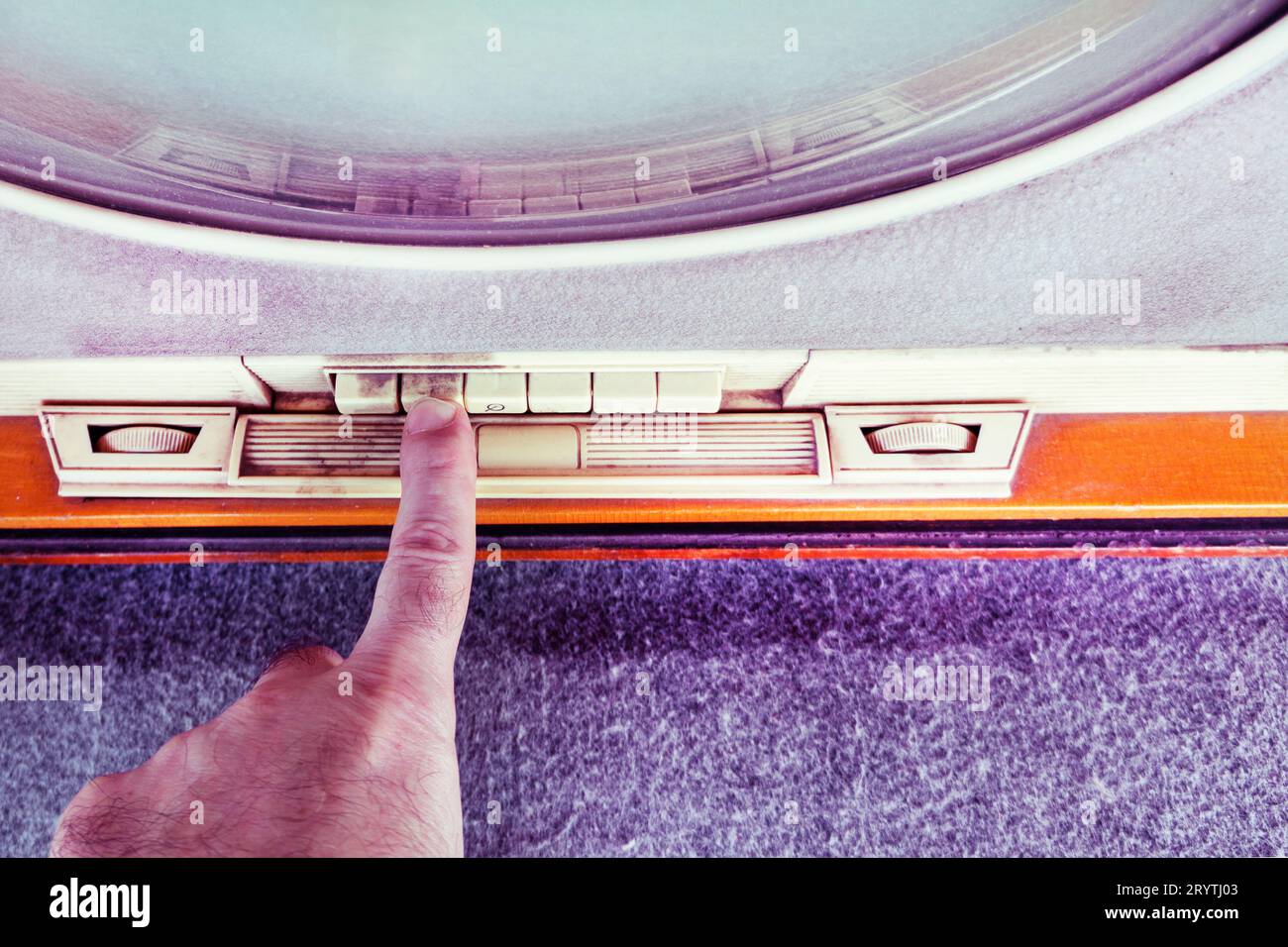 The hand changes channels on the retro old TV. Turning on of the ...