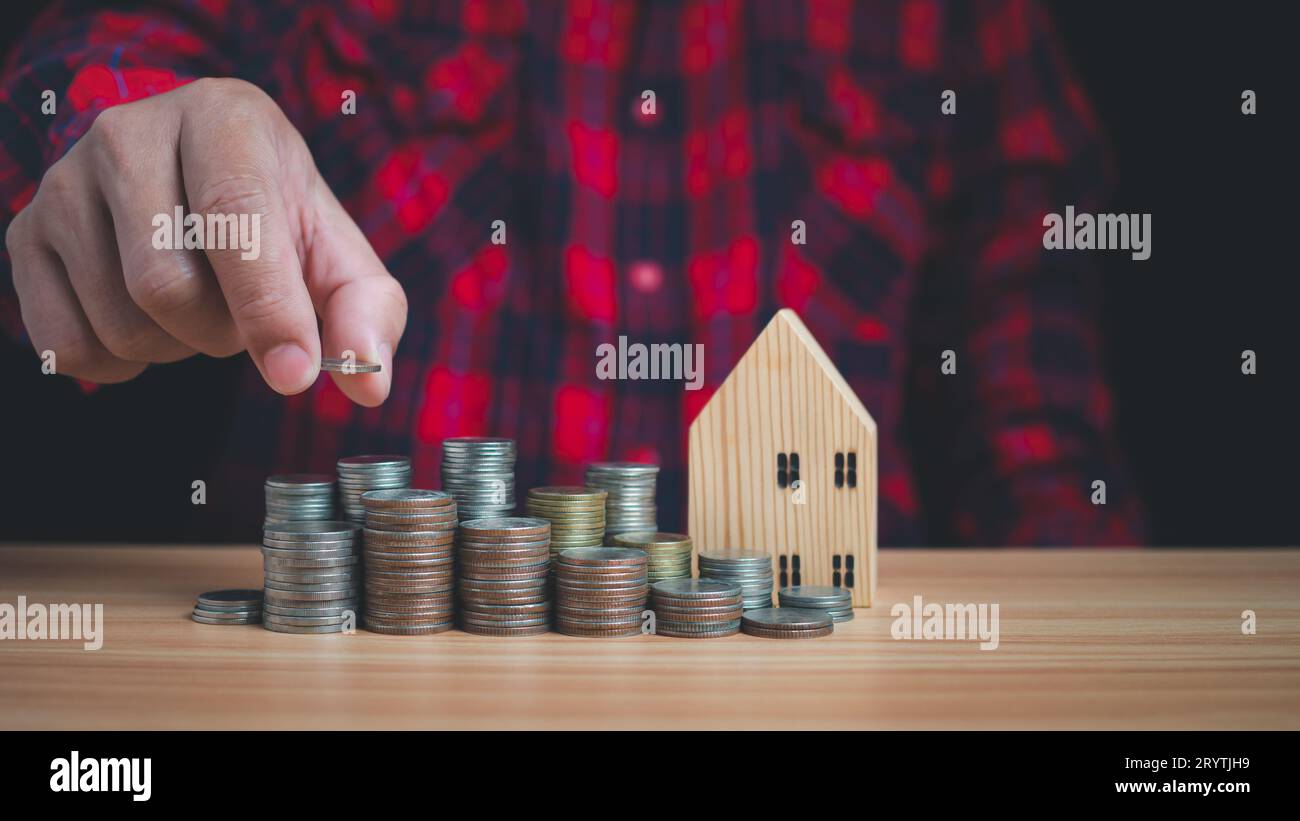 Human puts money on pile of coins. Ideas for investing and growing a ...