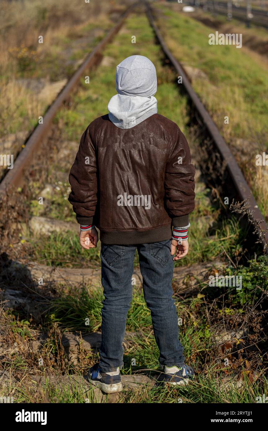 The boy on rails. The teen on the railroad. Concept beginning of a way ...