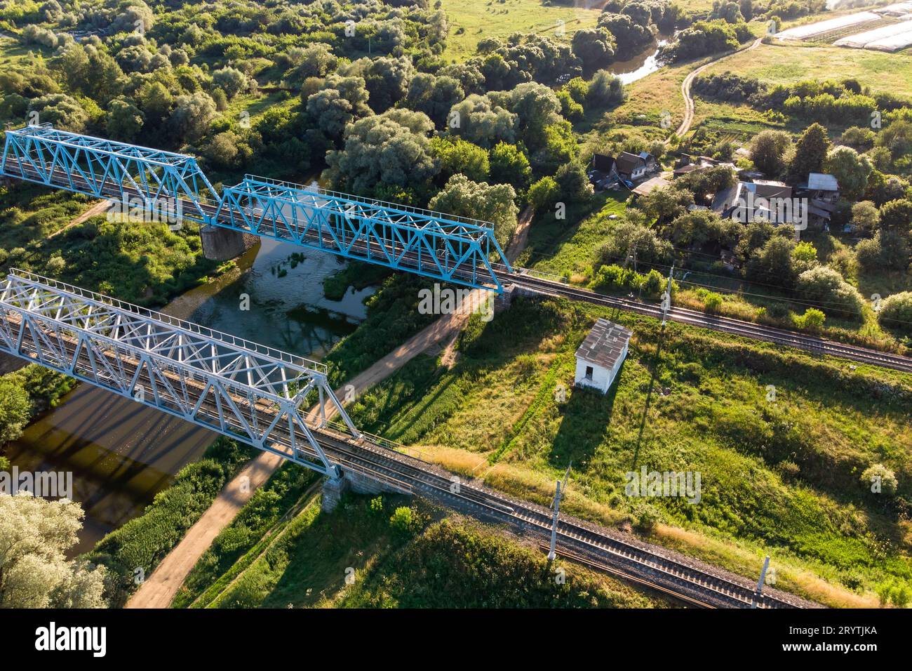 Rural landscape with a view of railway bridges. Farm located near the ...