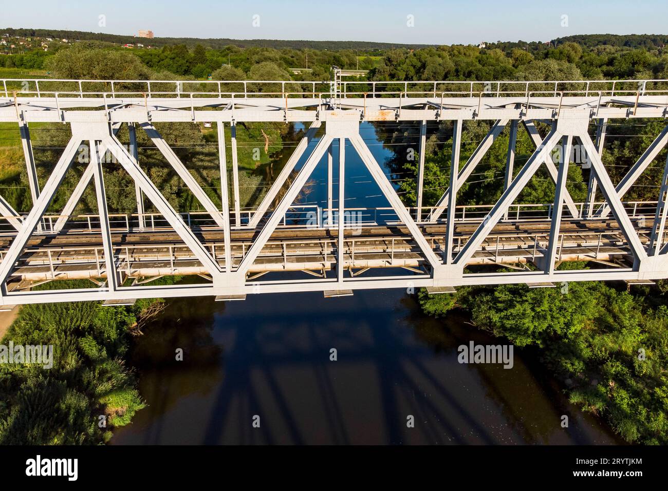 View of the structure of a metal railway bridge across the river Stock ...
