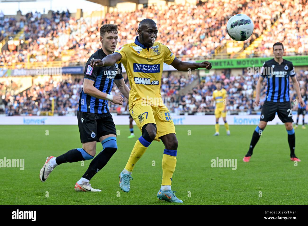 Andreas Skov Olsen (7) of Club Brugge defending on Aboubakary Koita (7 ...