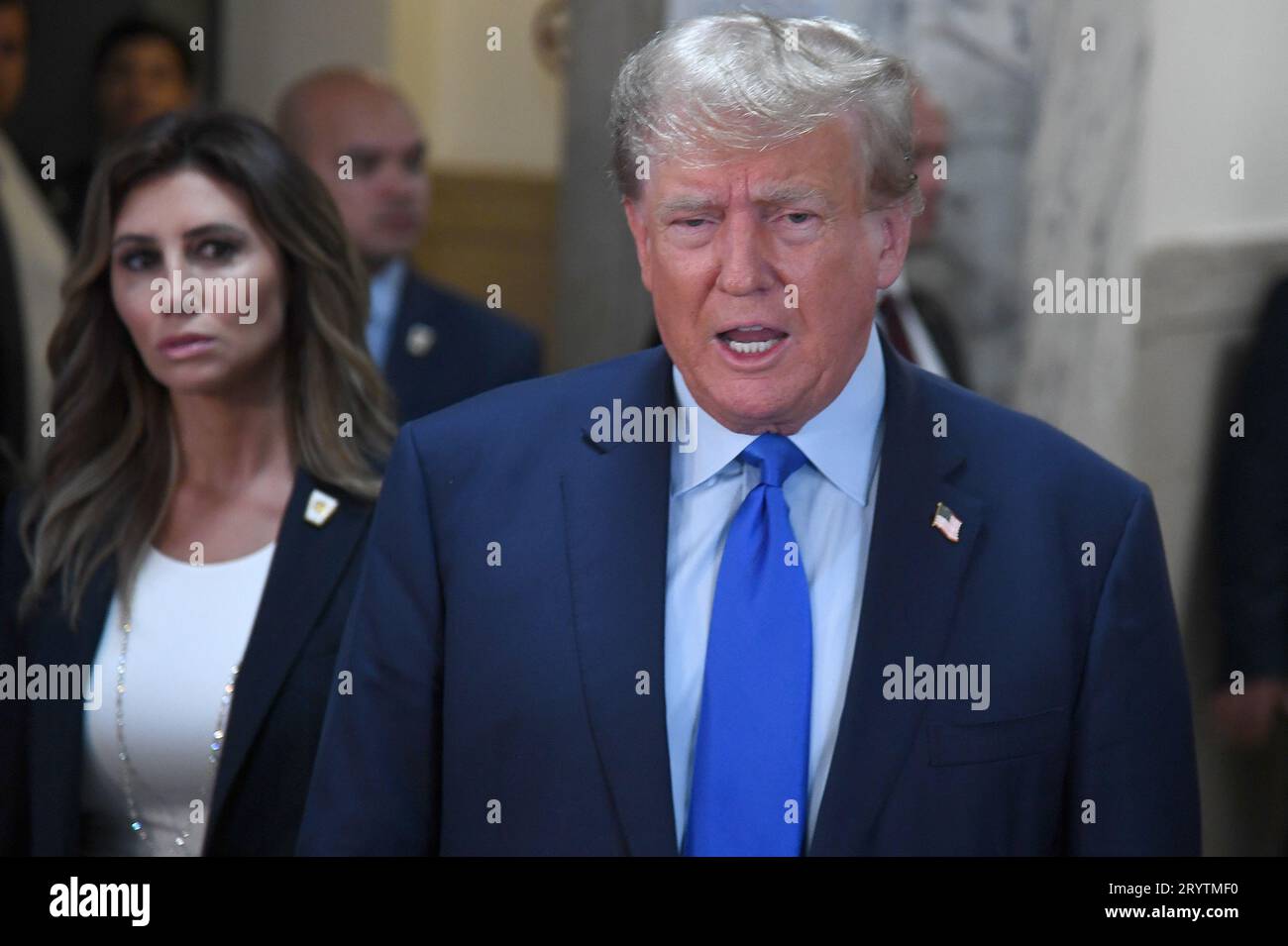 Attorney Alina Habba (l) listens as former U.S. President Donald Trump ...