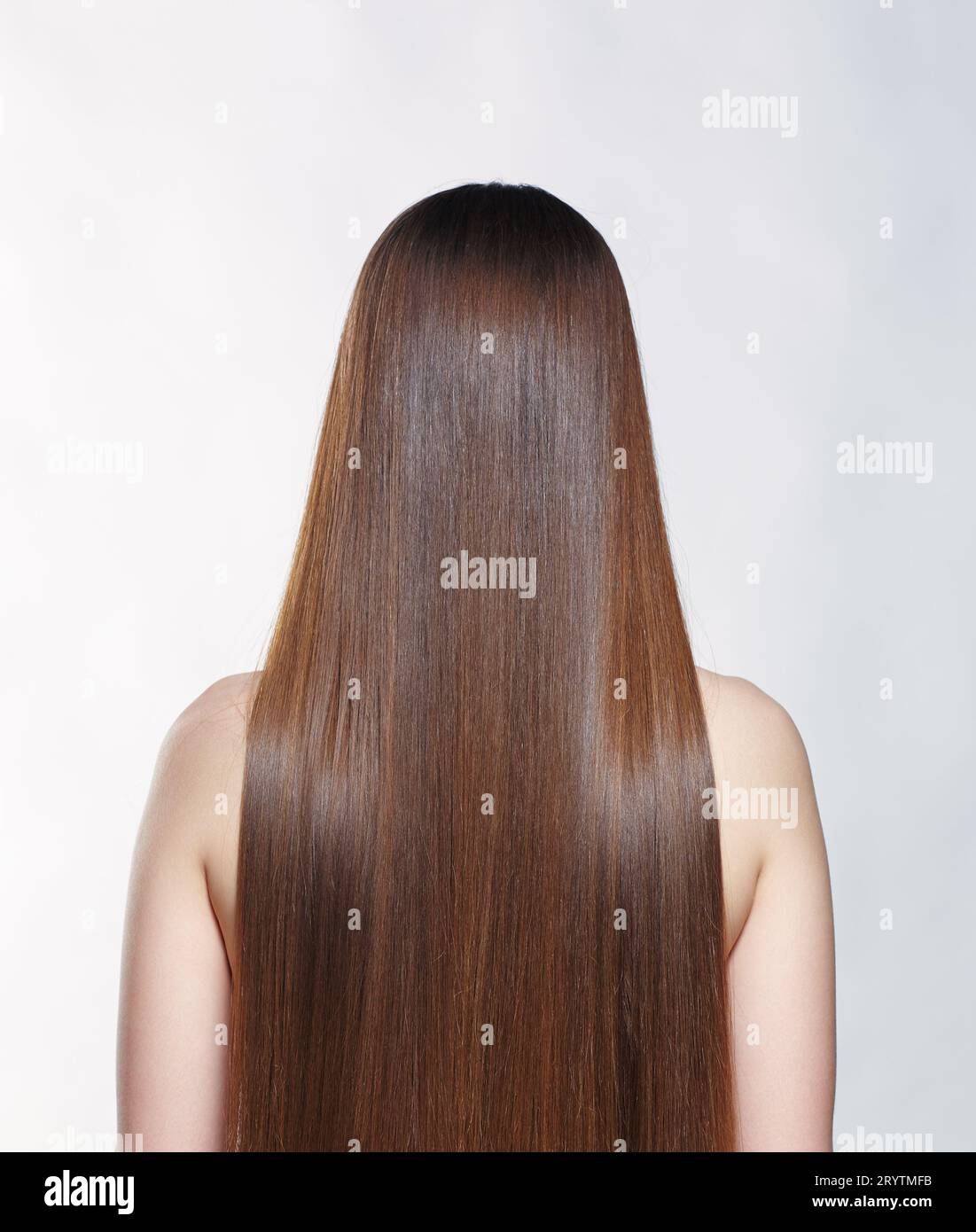 A woman from the back with very long brown hair Stock Photo - Alamy