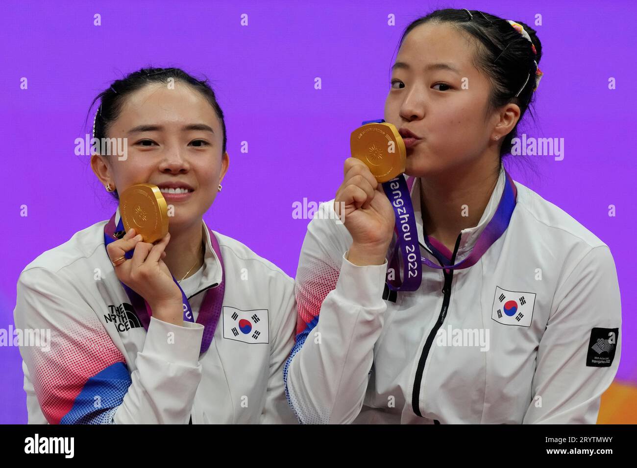 South Korea's Jeon Jihee, left and Shin Yubin pose for photographers with their gold medals ...
