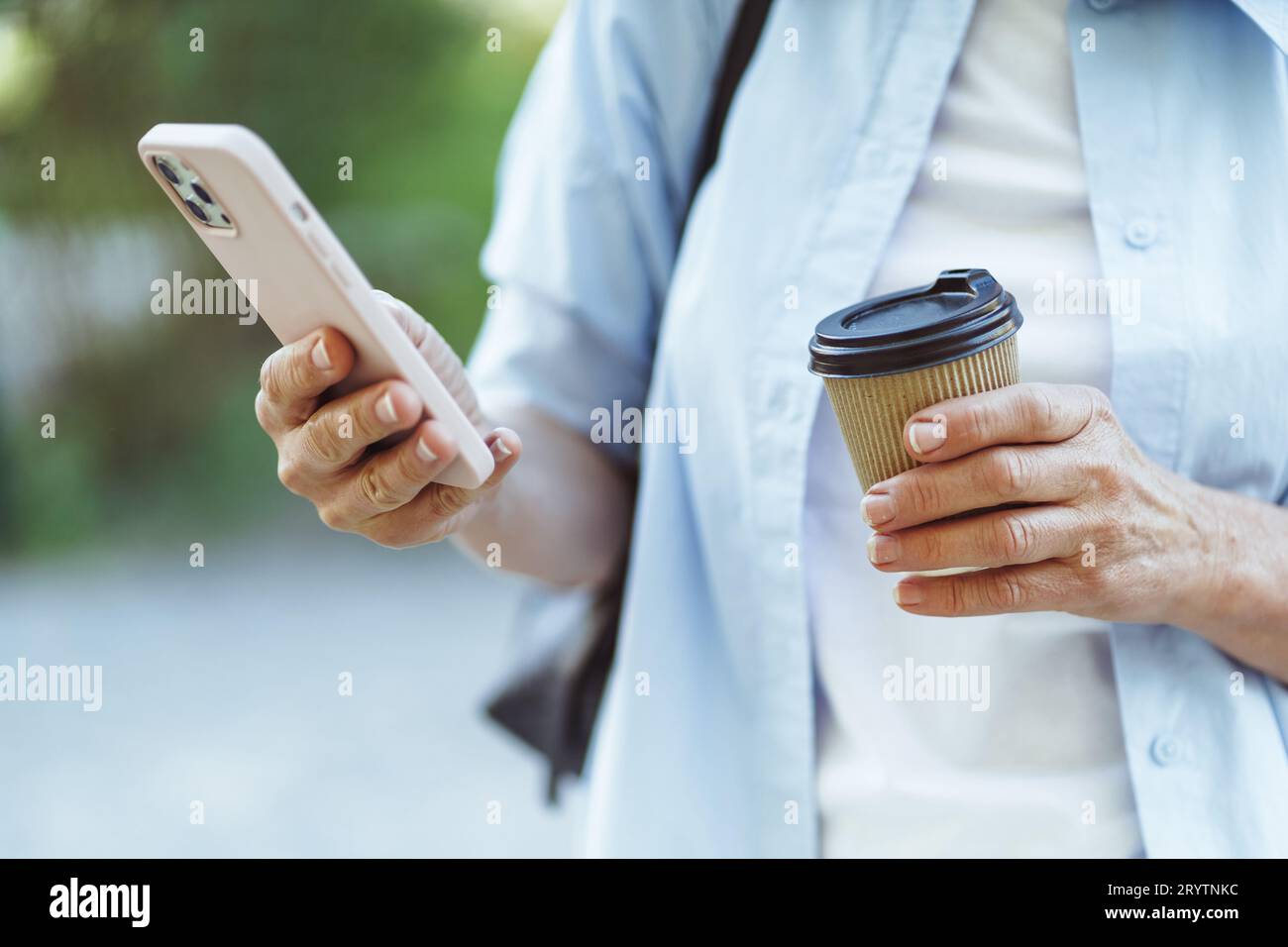 Cup of coffee alongside smartphone, symbolizing combination of digital ...