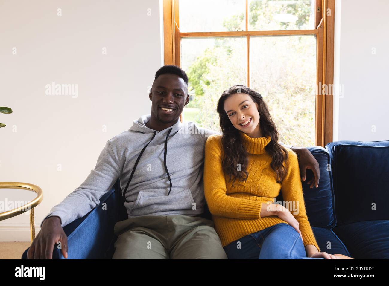 Portrait happy diverse couple sitting hi-res stock photography and ...