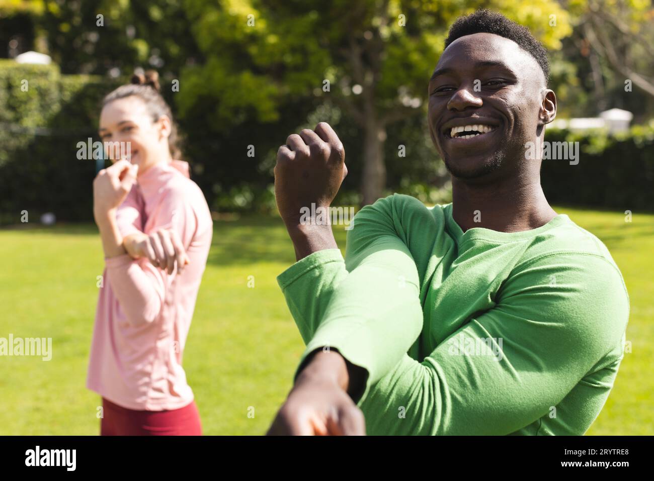 Happy diverse couple practicing yoga hi-res stock photography and ...