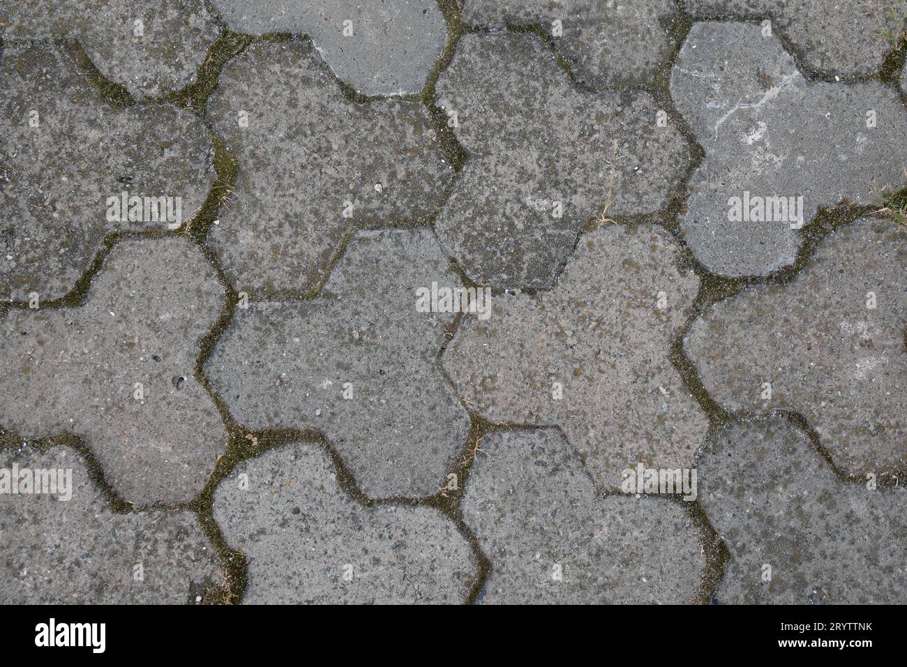 Concrete polygonal tiles. Construction background Stock Photo - Alamy