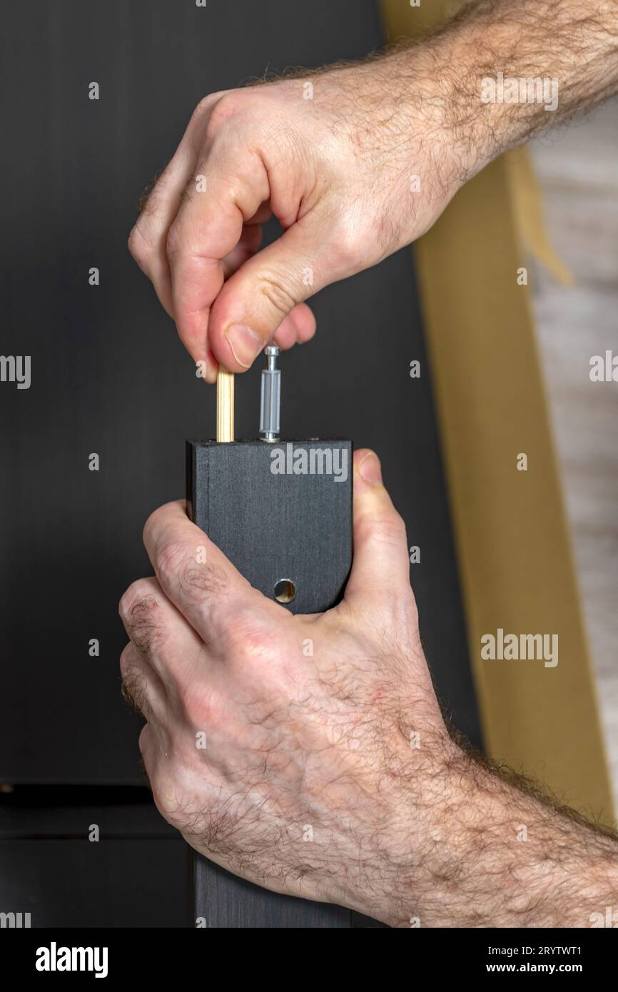 Hand and fittings. Inserting wood joints. Installation of wooden ...