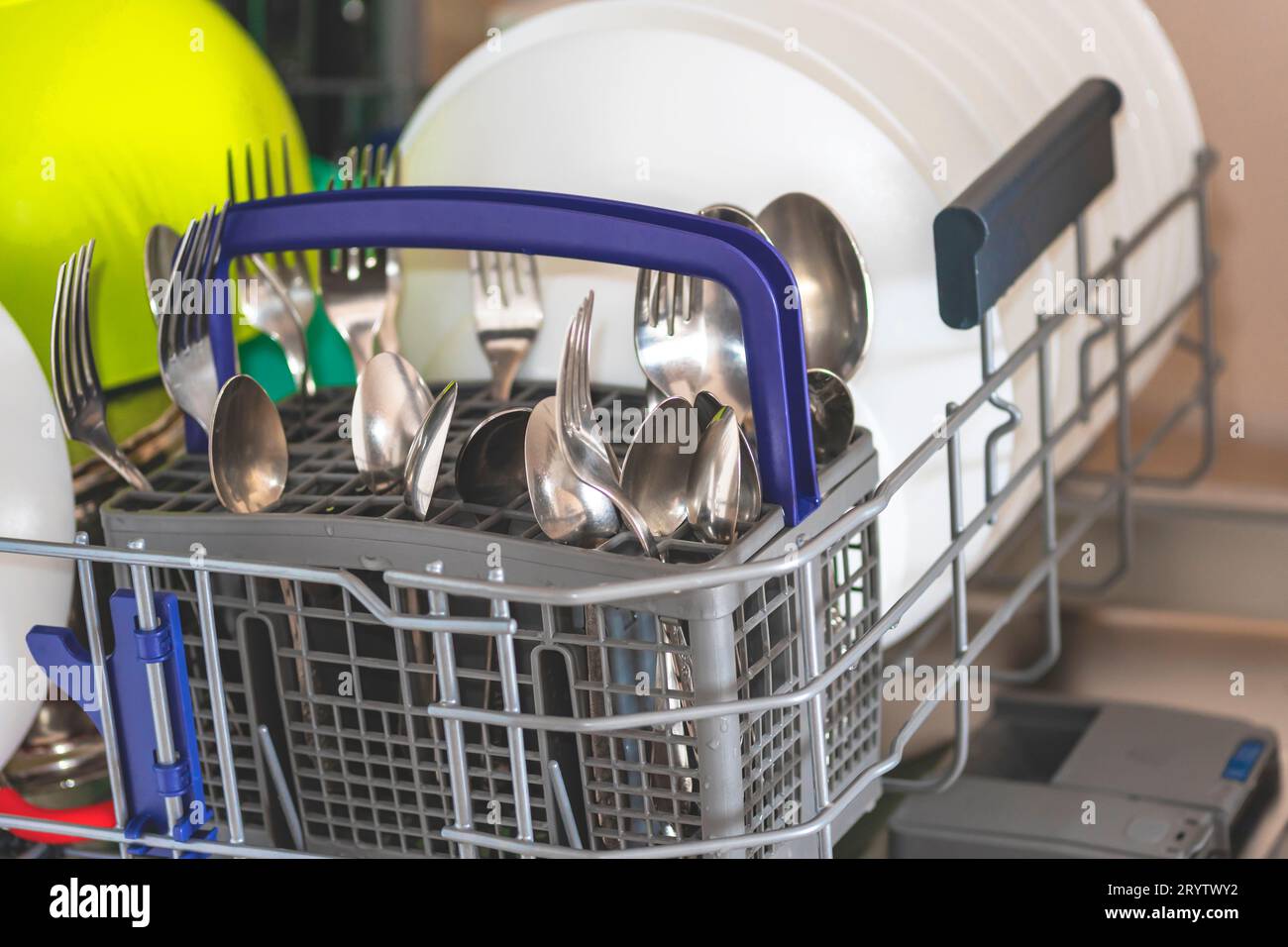 Open dishwasher. The washed dishes. Clean cutlery. Kitchen hygiene ...