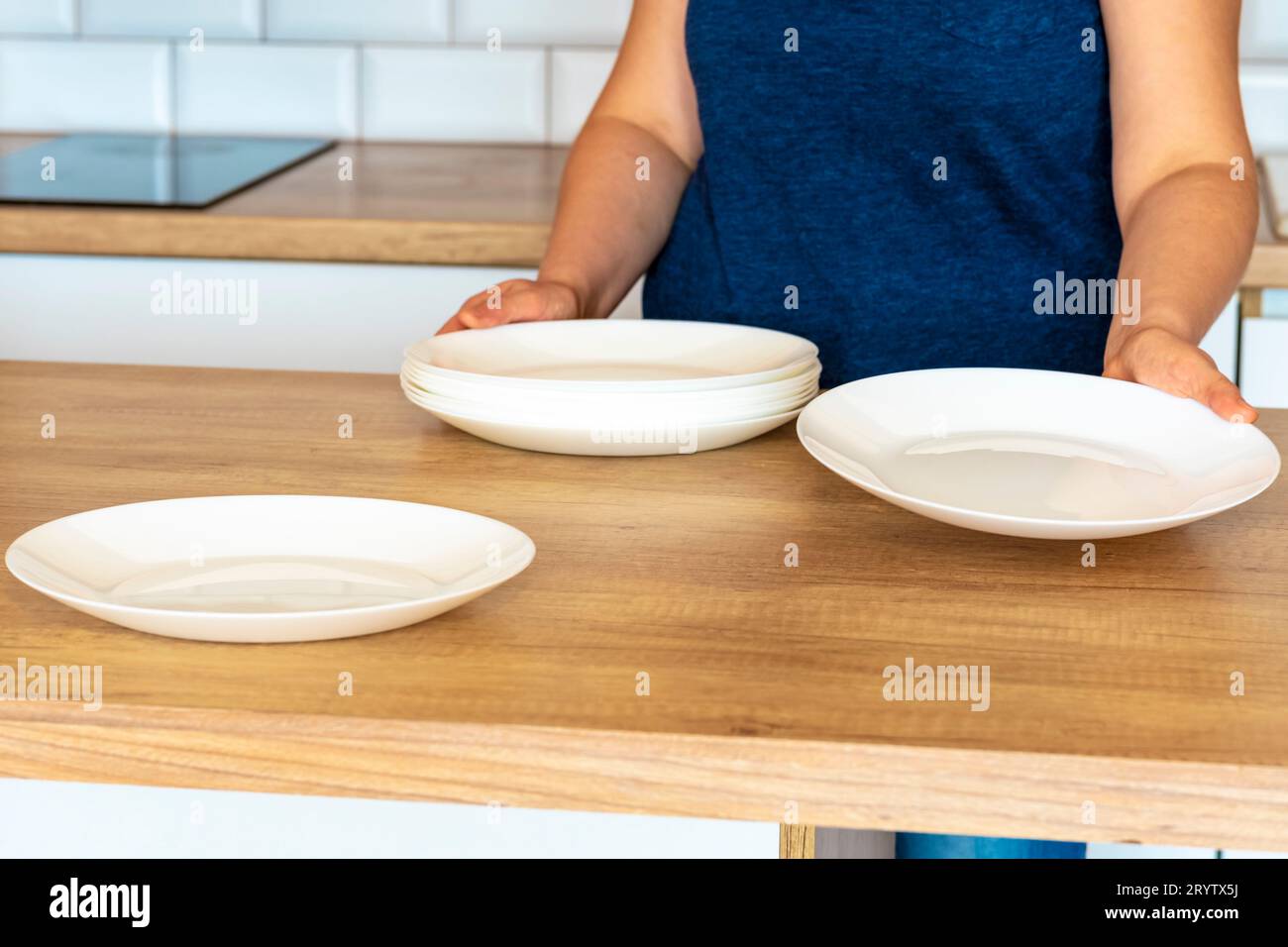Dirty plates kitchen table hi-res stock photography and images - Alamy