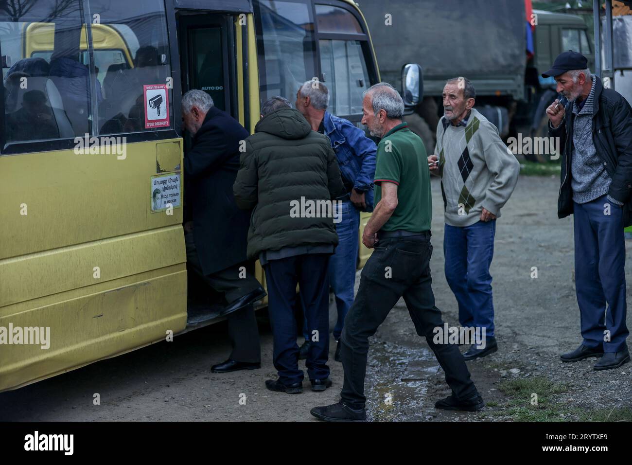 Ethnic Armenian men from Nagorno-Karabakh get on a bus to Armenia's ...