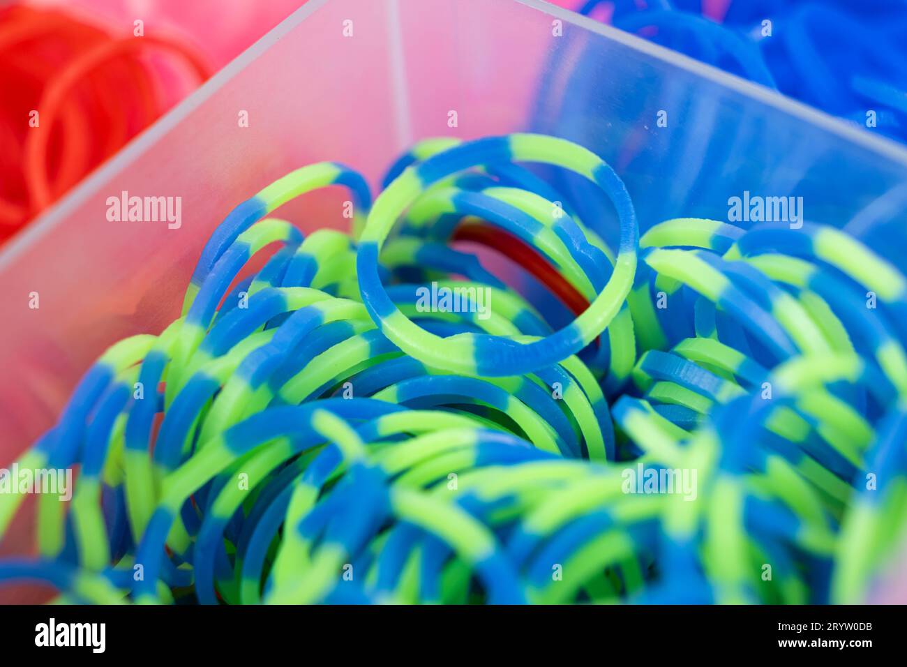 Girl weaving colored rubber hi-res stock photography and images - Alamy