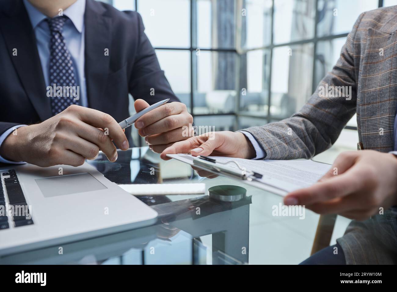 Business negotiations. Two colleagues talking in the office Stock Photo ...