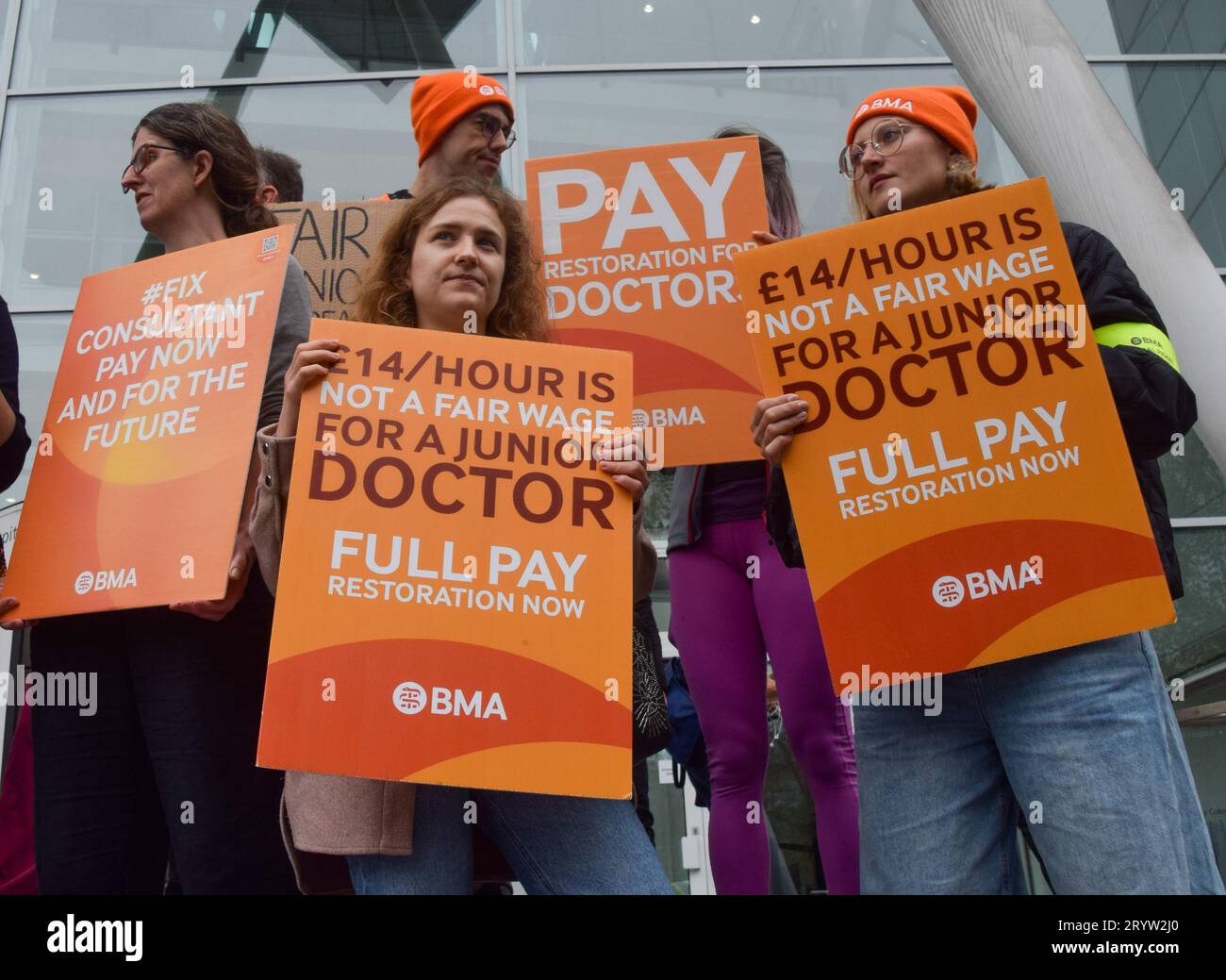 London, UK. 02nd Oct, 2023. Doctors stand with placards in support of ...