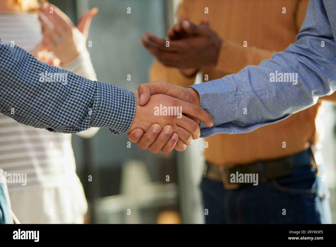 Hands of multi-ethnic people shake hands close up view Stock Photo - Alamy