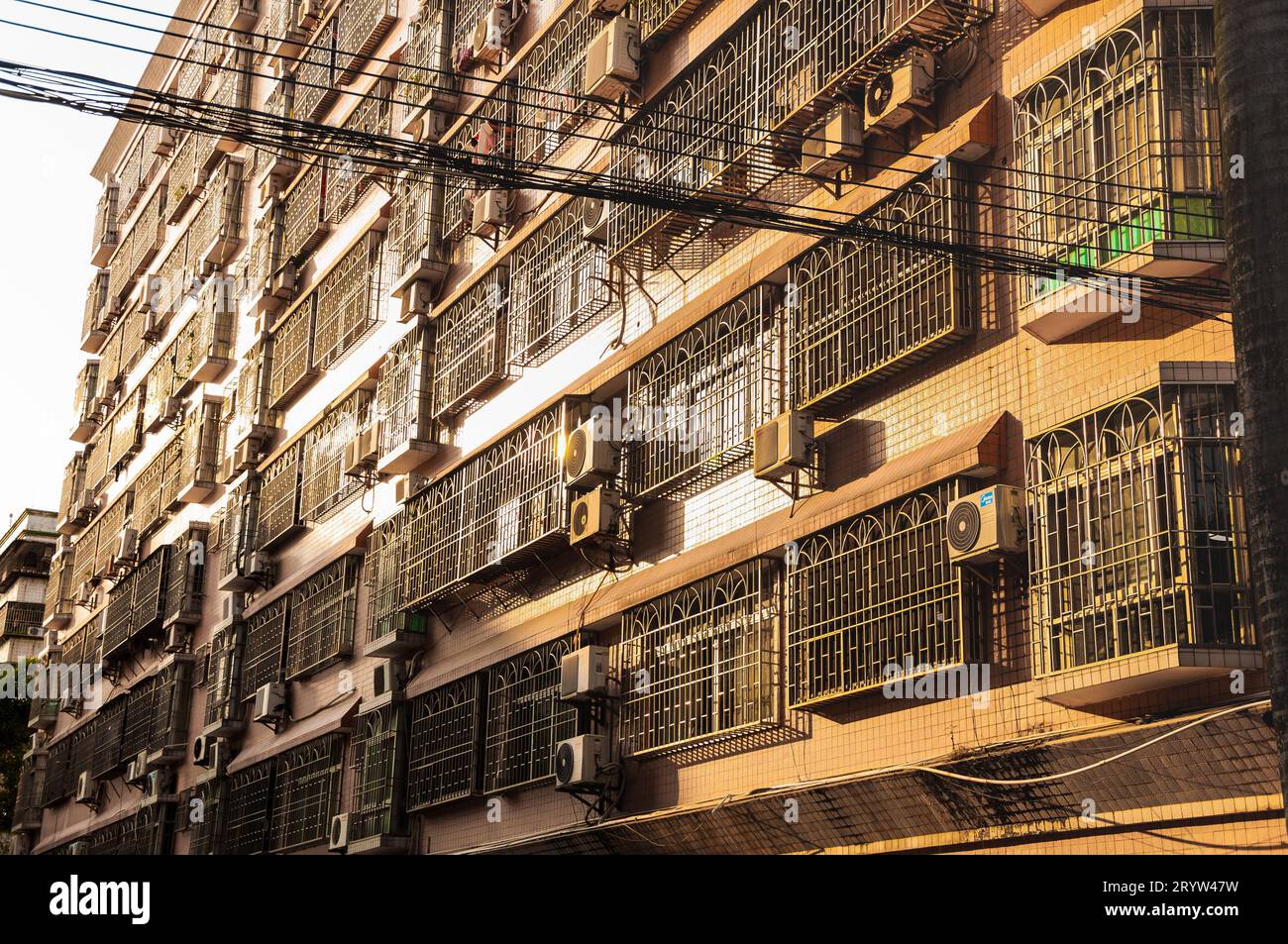 This image depicts a multi-story building situated among a network of ...