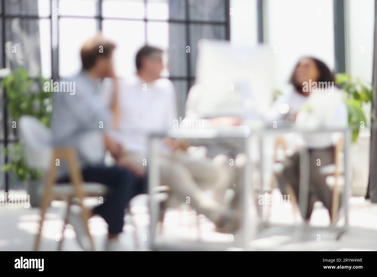 Conversation between managers and employees in the office. Blurred ...