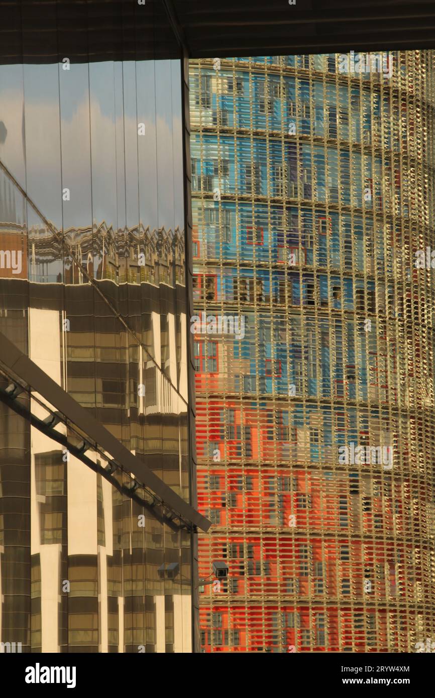 An airplane is flying towards a modern skyscraper with a reflective ...