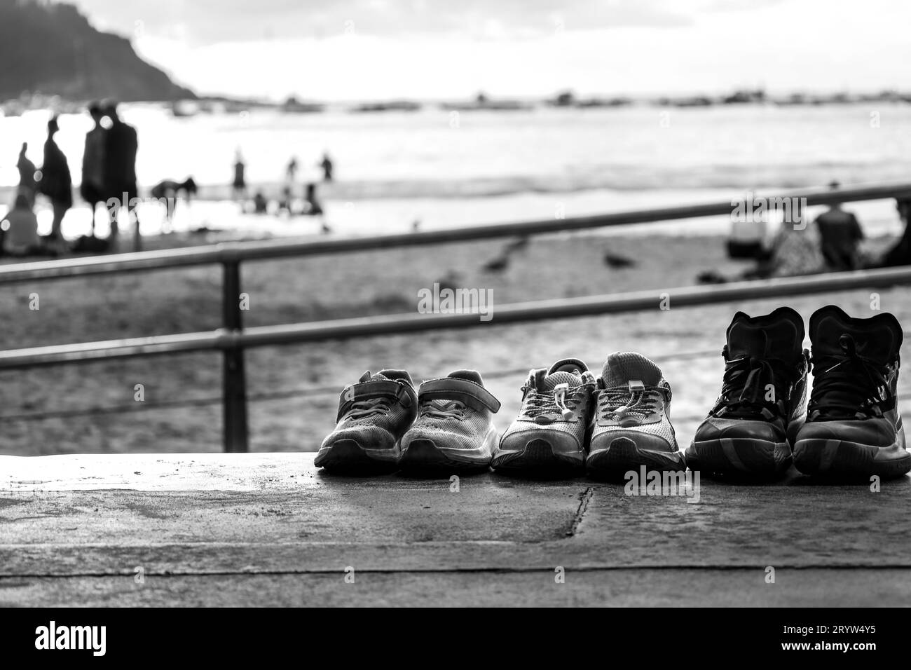 Three pairs of shoes on the ground near the beach in Spain Stock Photo ...