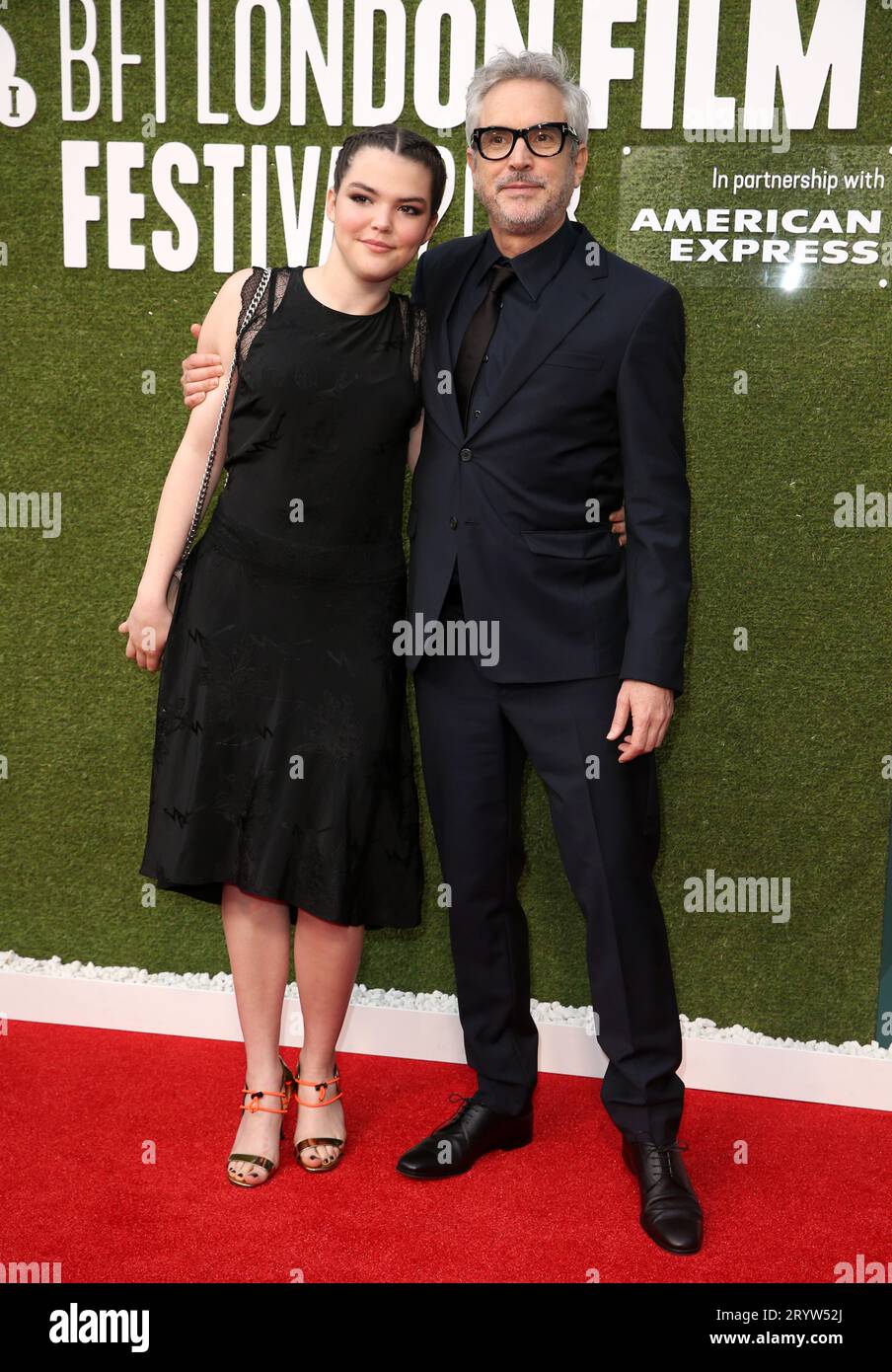 London, UK. 13th Oct, 2018. Alfonso Cuaron and his daughter Tess Bu ...