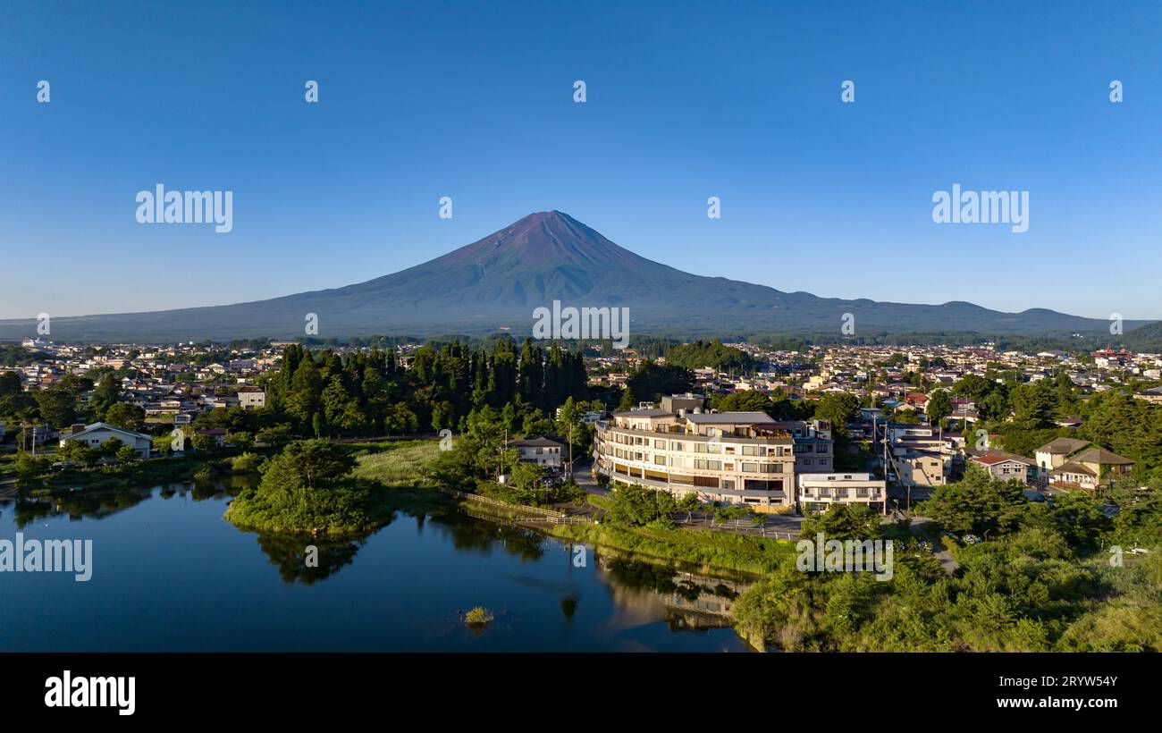 Aerial shot of the Fujikawaguchiko town and the Fuji mountain in sunny ...
