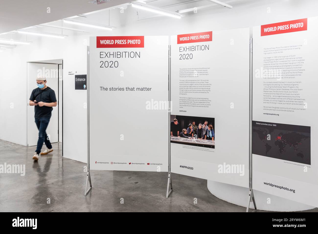 A visitor leaves the World Press Photo Exhibition. The 2020 edition of ...