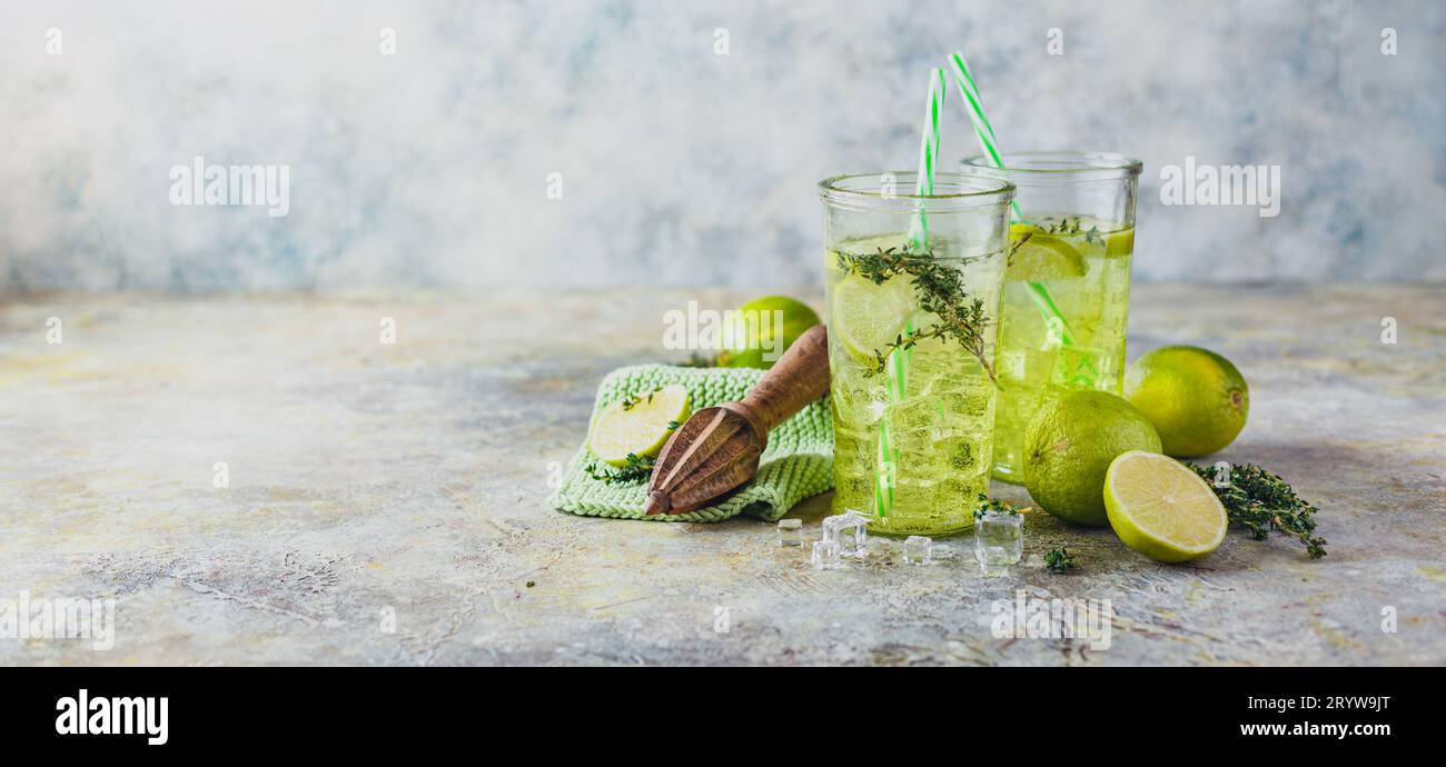Lime Lemonade with thyme and ice Stock Photo - Alamy
