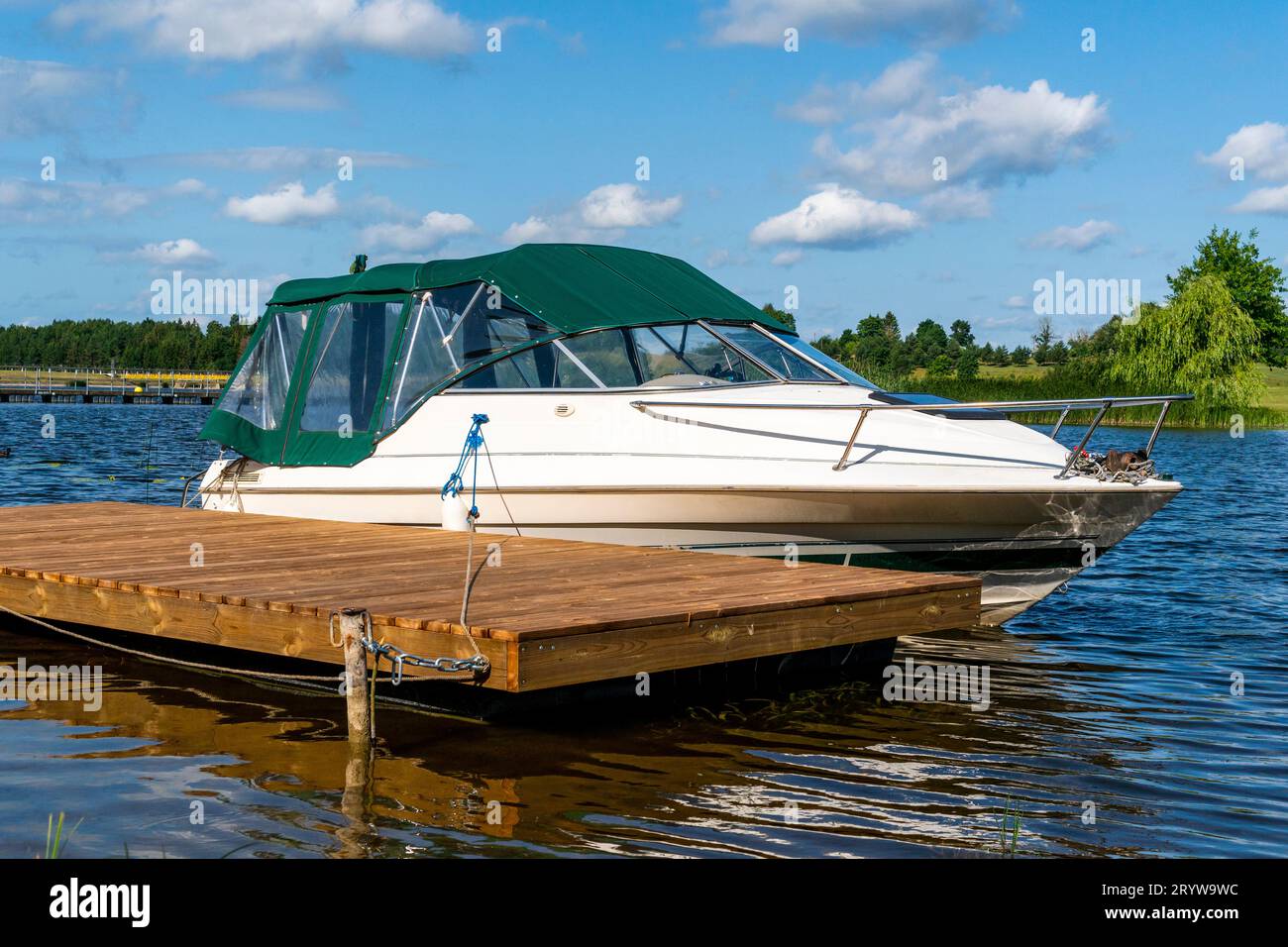 Cutter moored to a pier. Fishing, swimming and boating area Stock Photo ...
