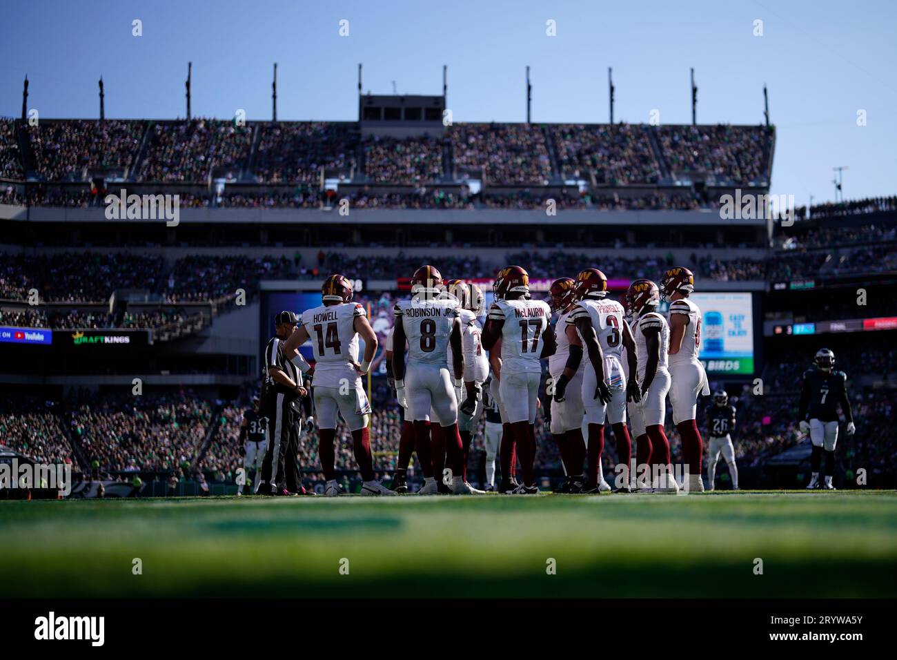 Washington Commanders' players huddle during an NFL football game ...