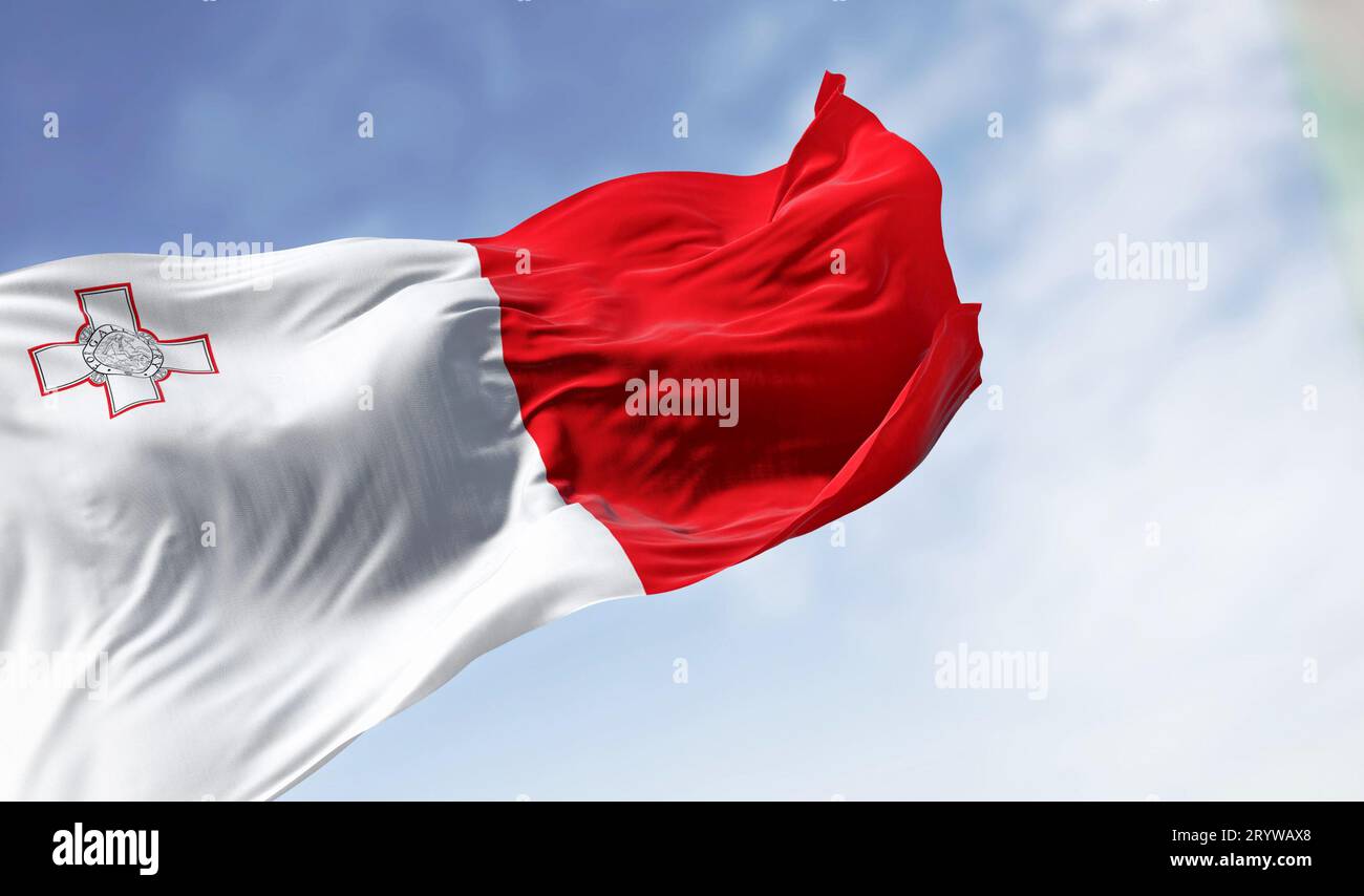 Malta national flag waving in the wind on a clear day. White and red ...