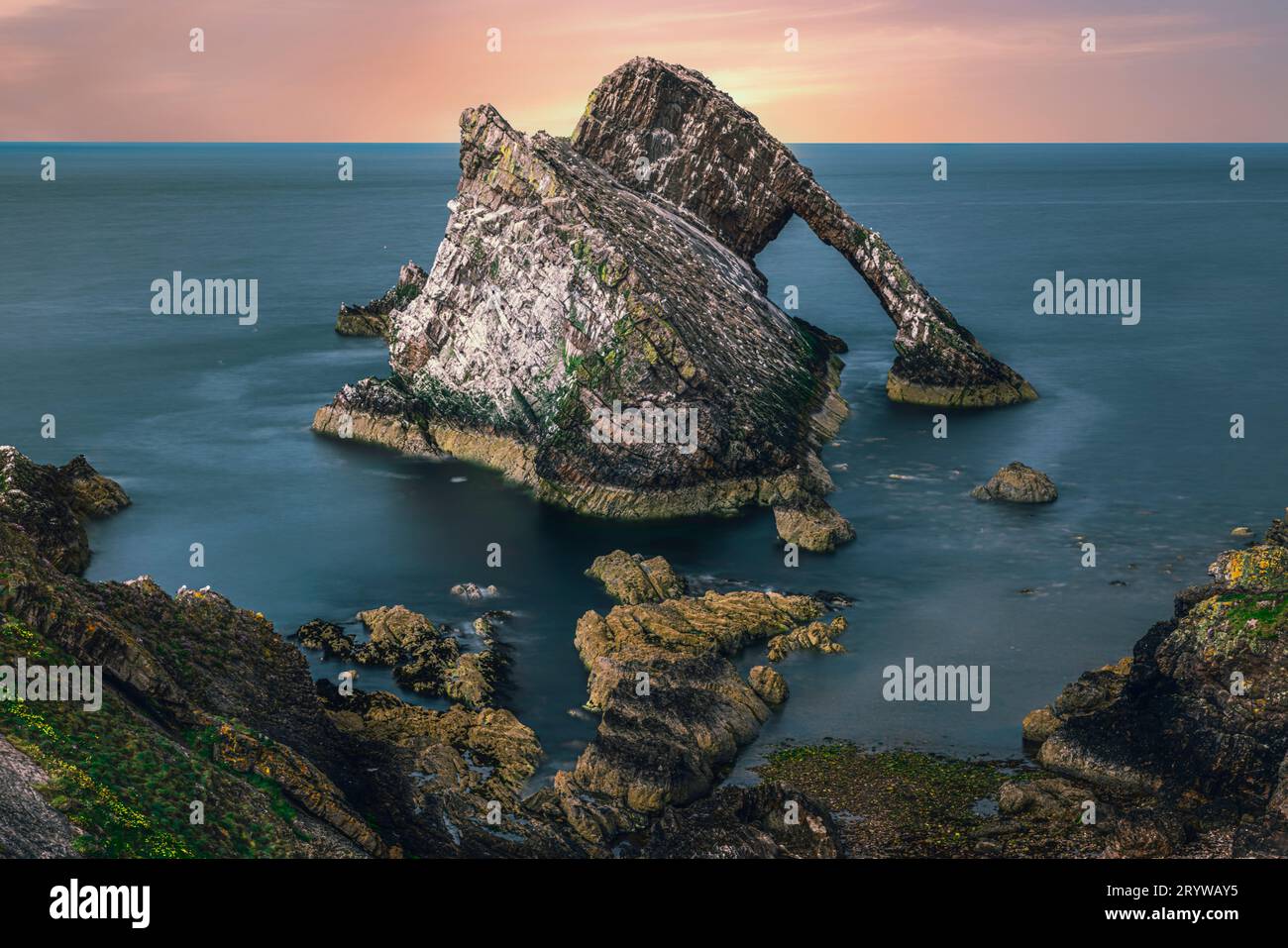 The sea stack Bowfiddle Rock near Portknockie in Moray, Scotland Stock ...