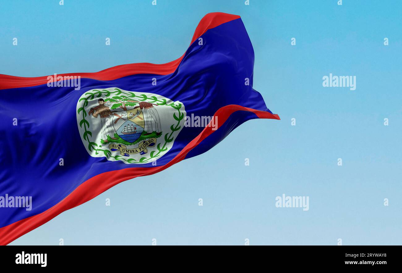 Belize national flag waving in the wind on a clear day. Blue field, red ...