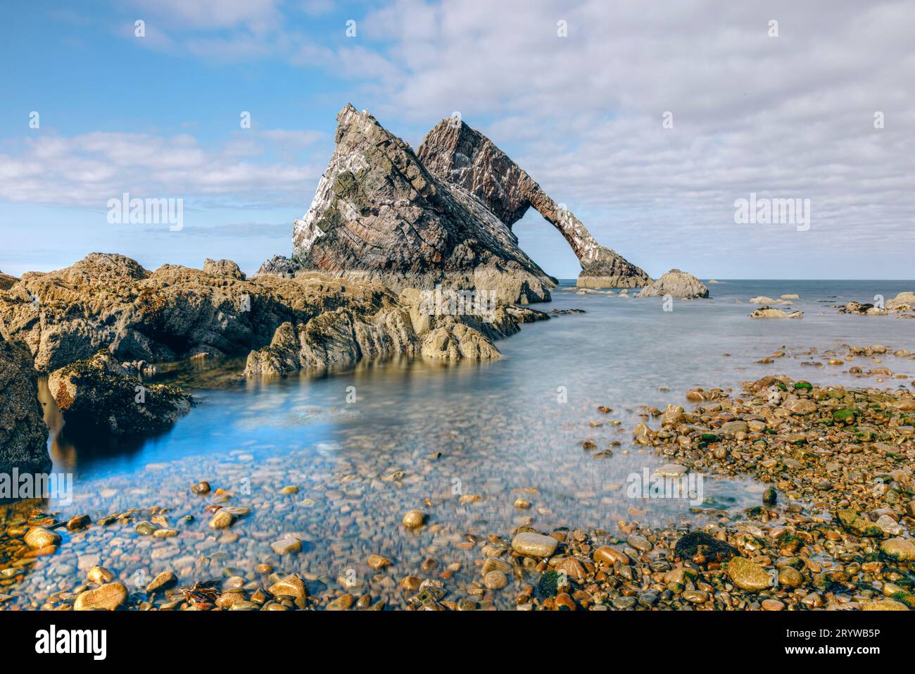 The sea stack Bowfiddle Rock near Portknockie in Moray, Scotland Stock ...
