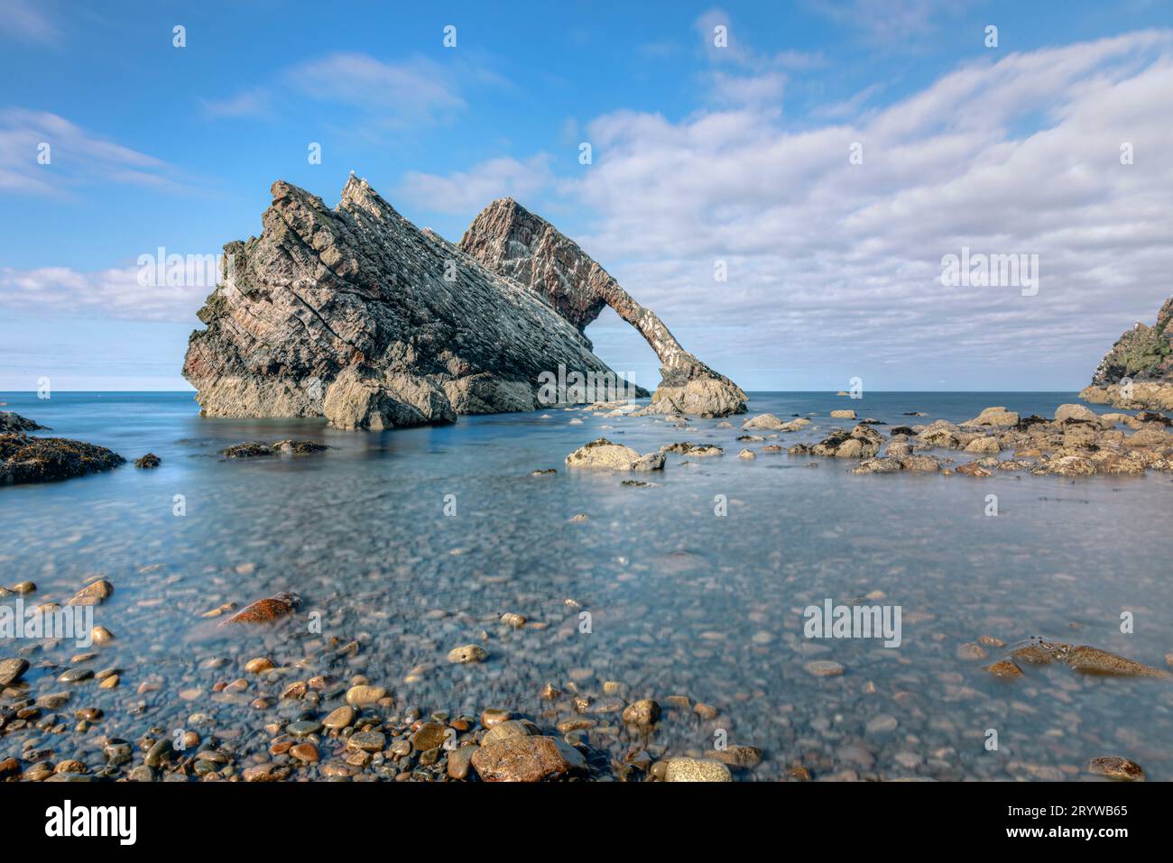 The sea stack Bowfiddle Rock near Portknockie in Moray, Scotland Stock ...