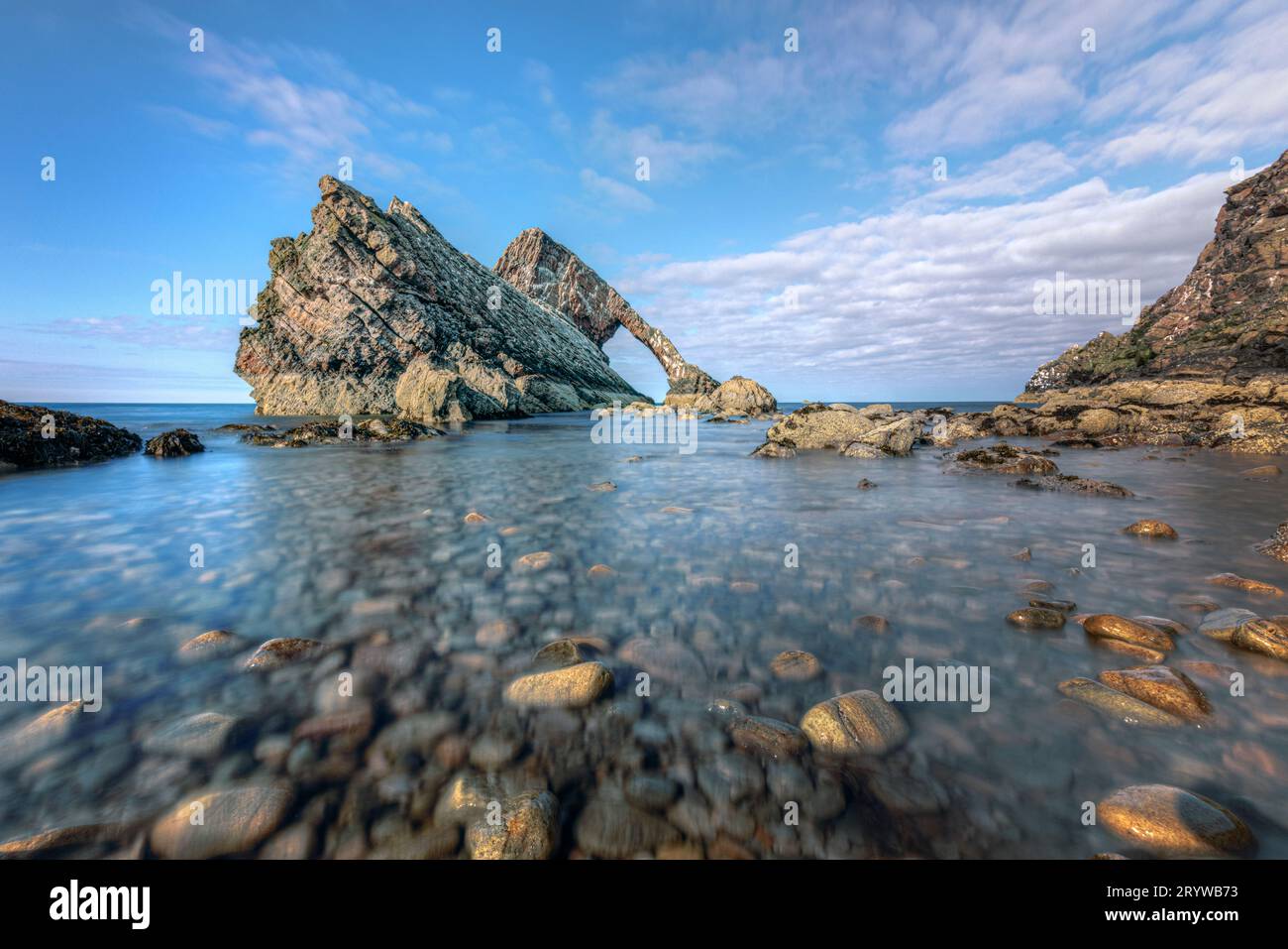 The sea stack Bowfiddle Rock near Portknockie in Moray, Scotland Stock ...