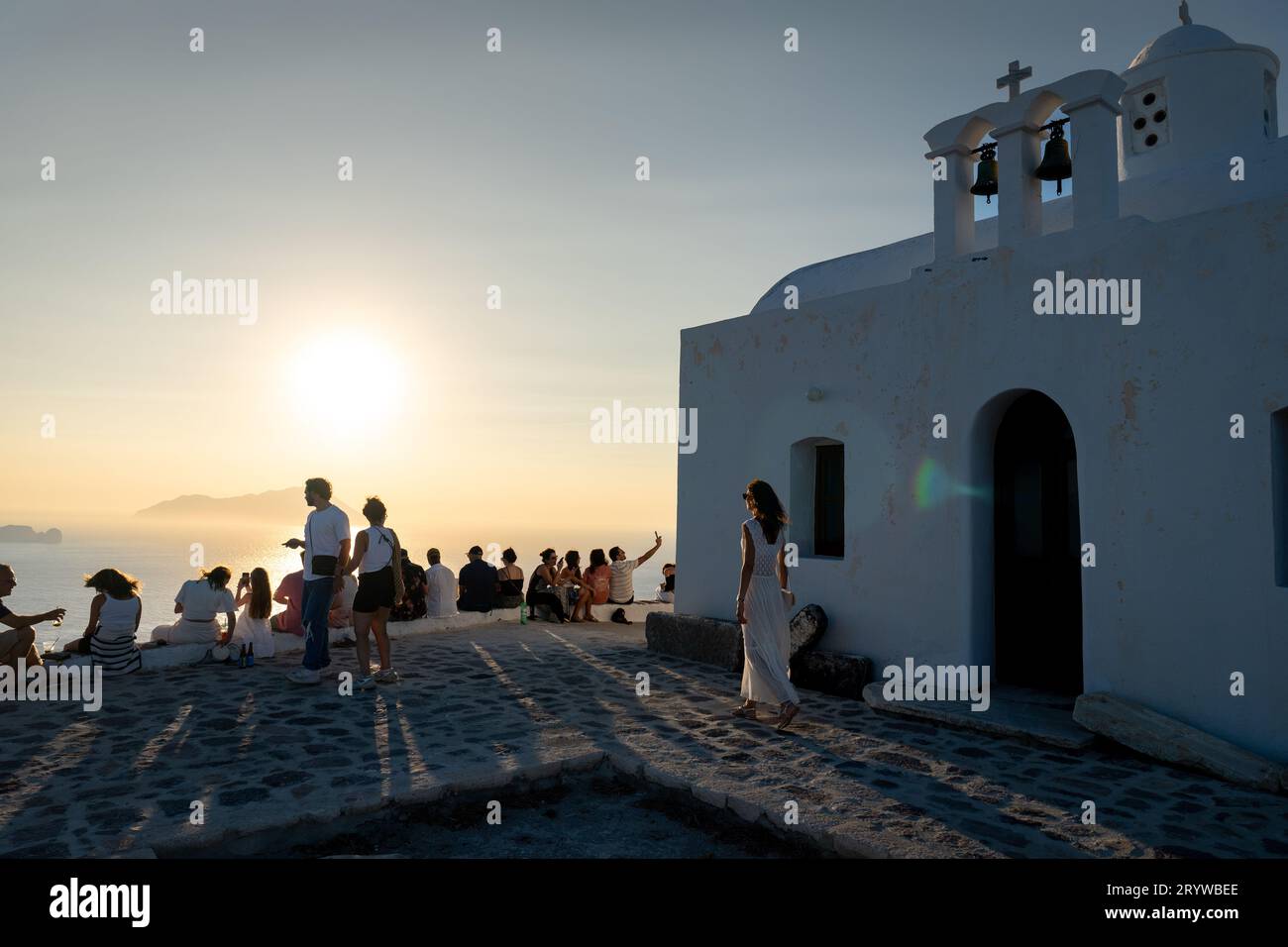 Unknown people watching sunset in Plaka, Milos Stock Photo - Alamy