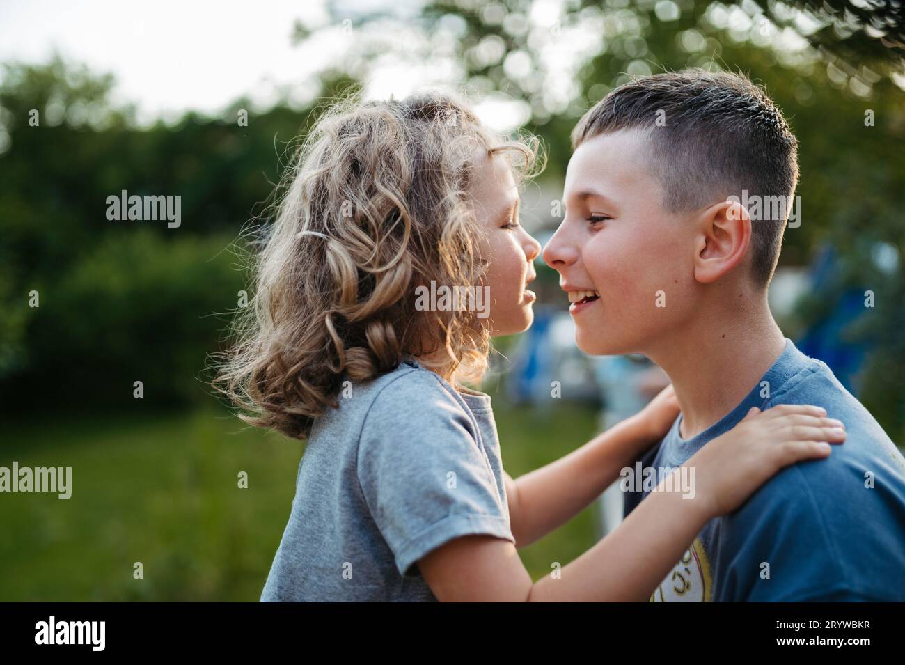Young brothers touching with noses Stock Photo - Alamy