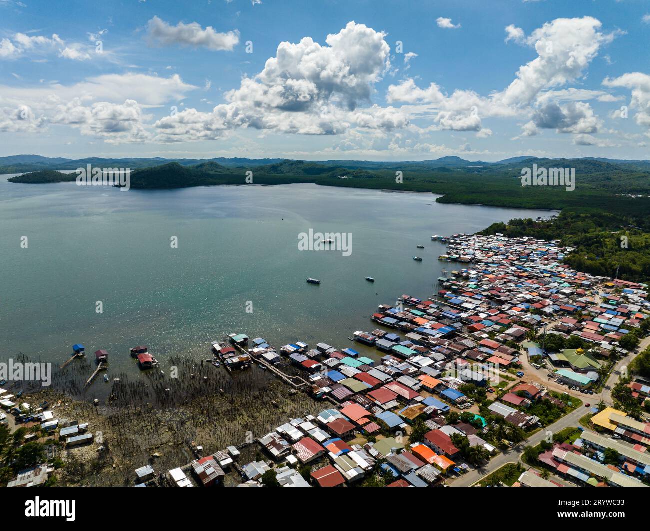 Aerial view of village of fishermen with houses on the water. Kudat ...