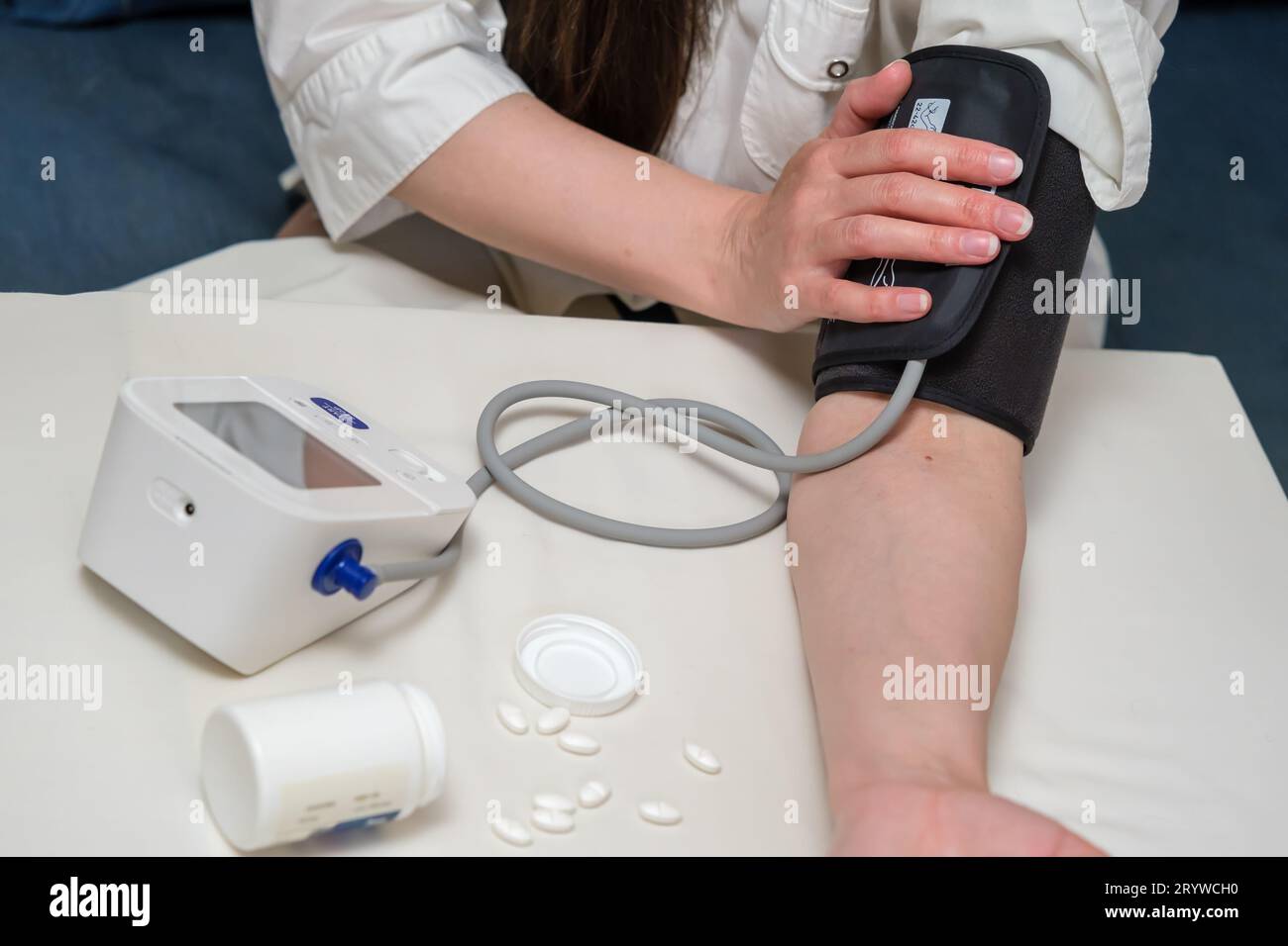 A woman measures her blood pressure. Self-medication concept Stock ...