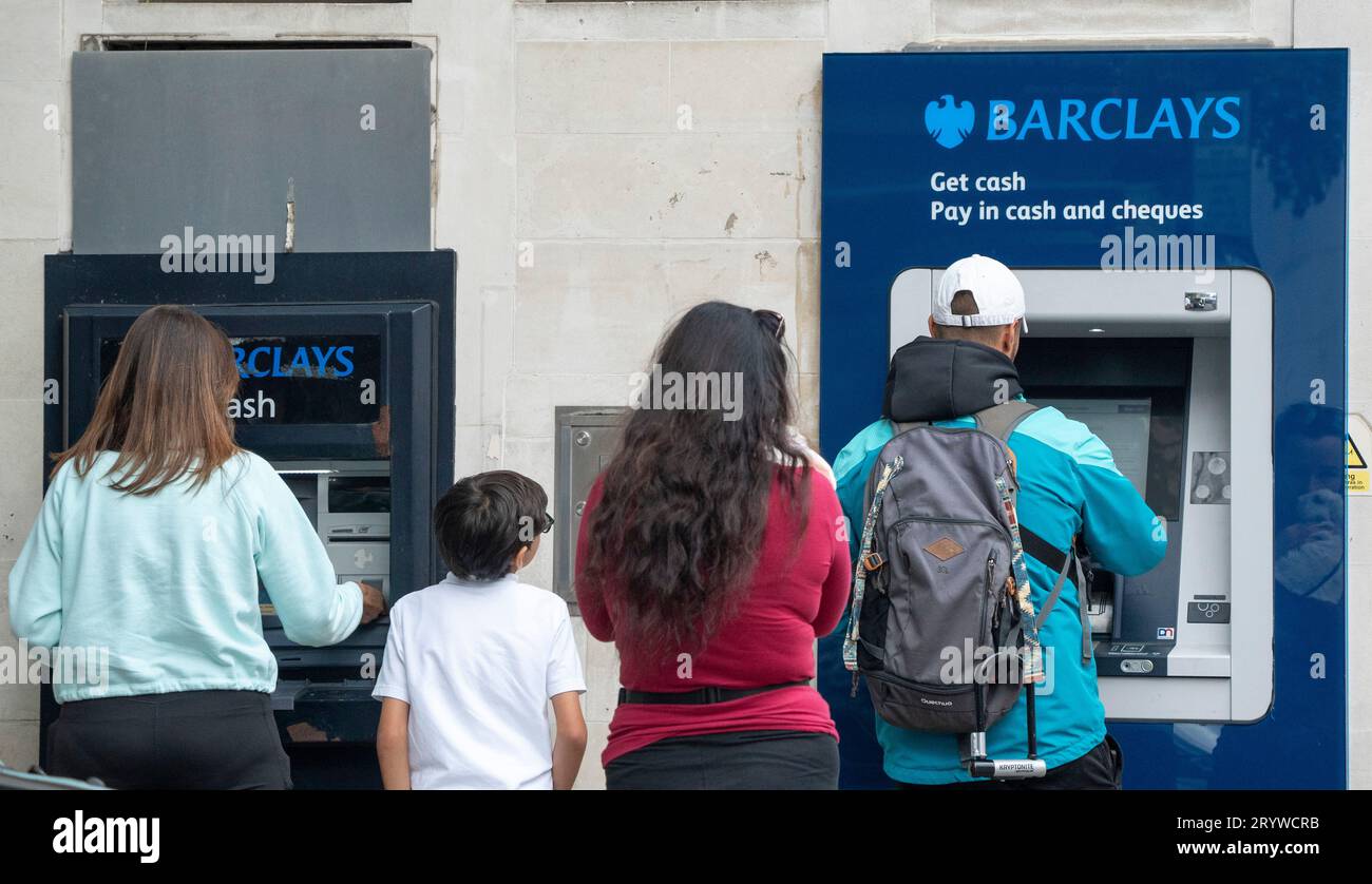 Customers use the cash machines outside the St John's Wood Branch of ...