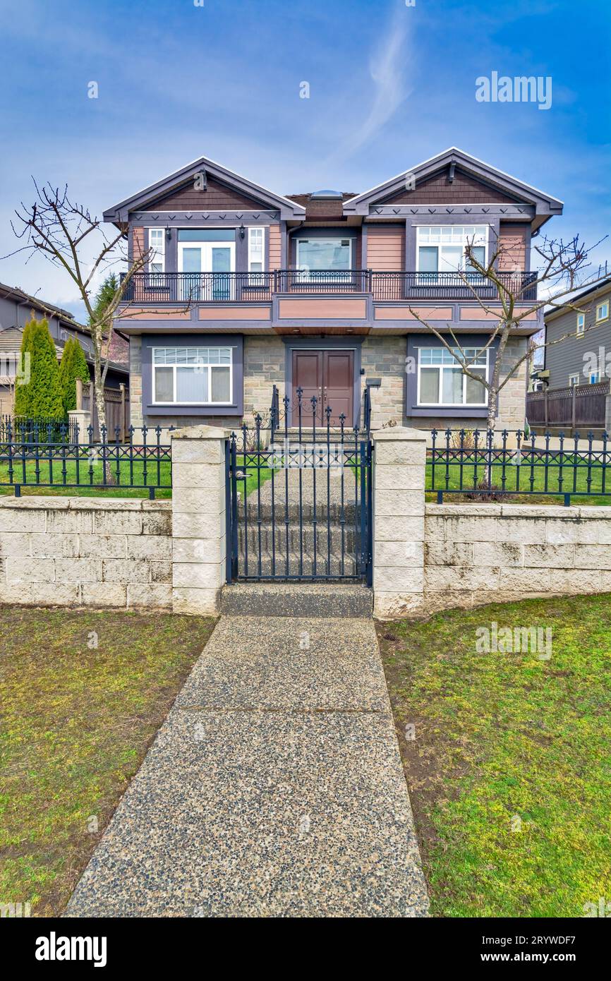 Big residential house with metal fence and gate on winter day Stock ...