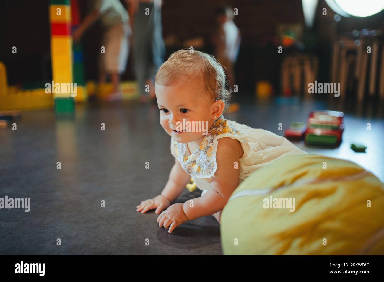 Portrait of baby crawling, exploring the interior of the children's ...