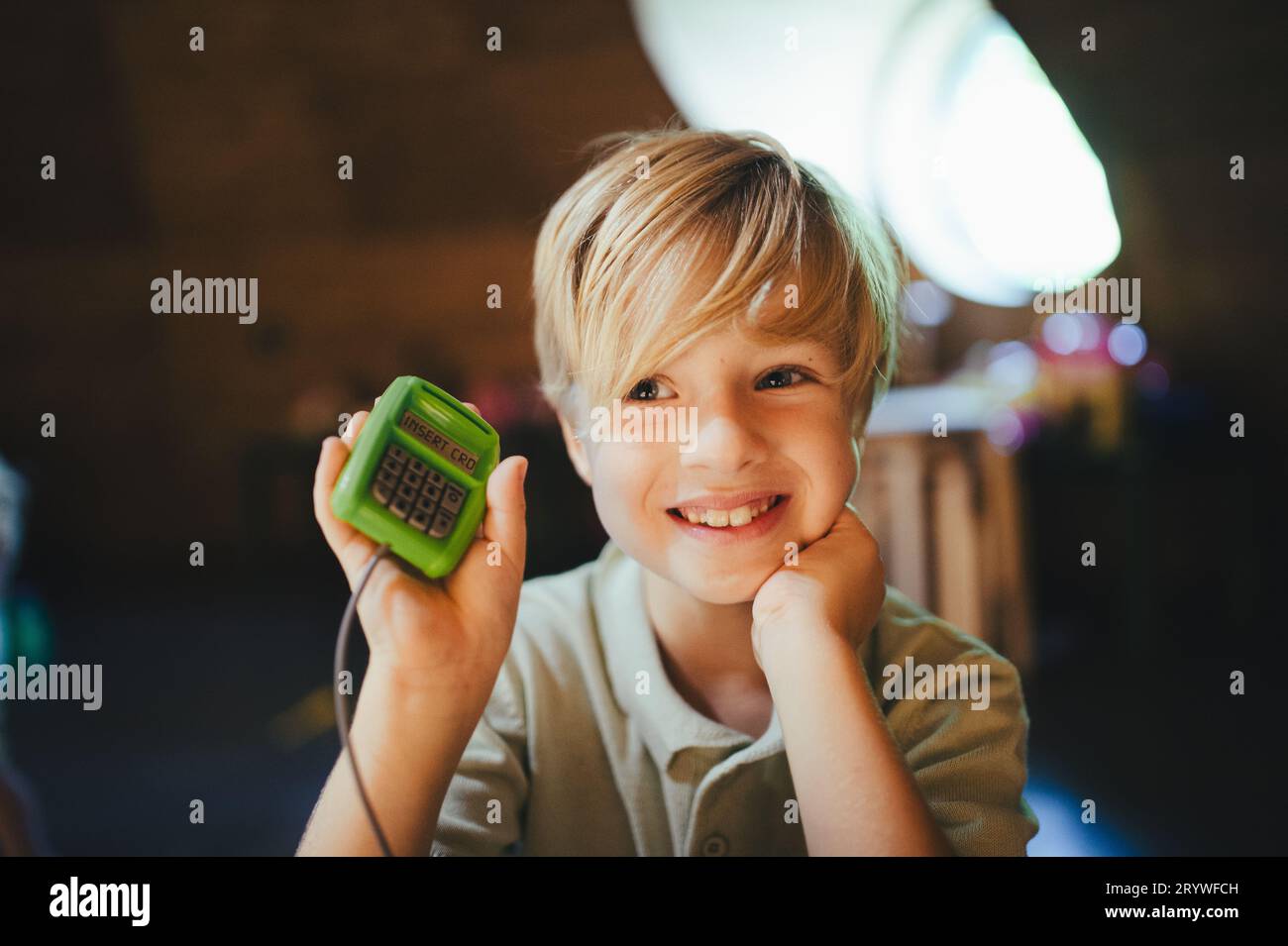 Portrait of boy playing as cashier in a store Stock Photo - Alamy